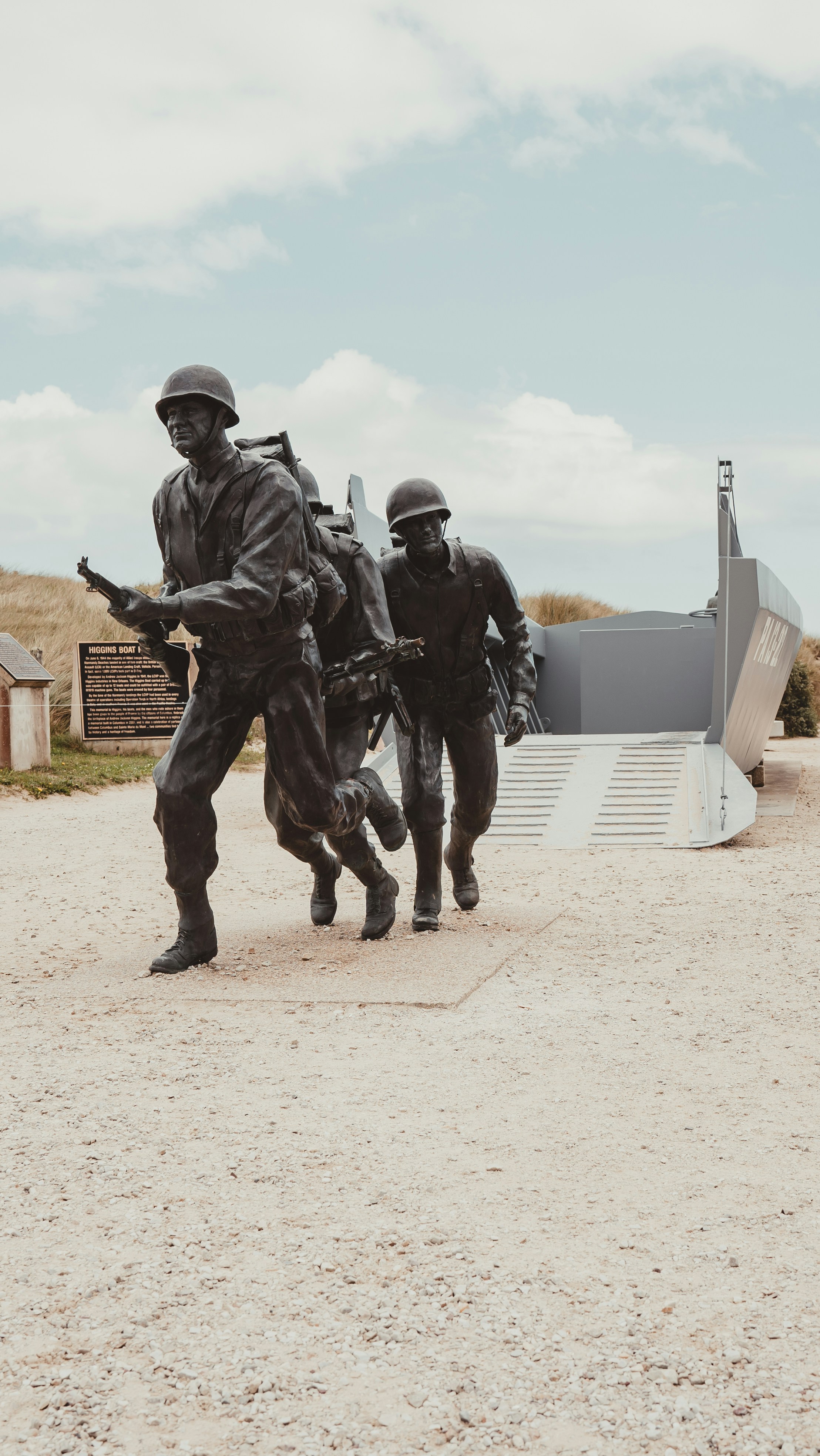 A group of men in military uniforms running photo – Free Utah beach ...