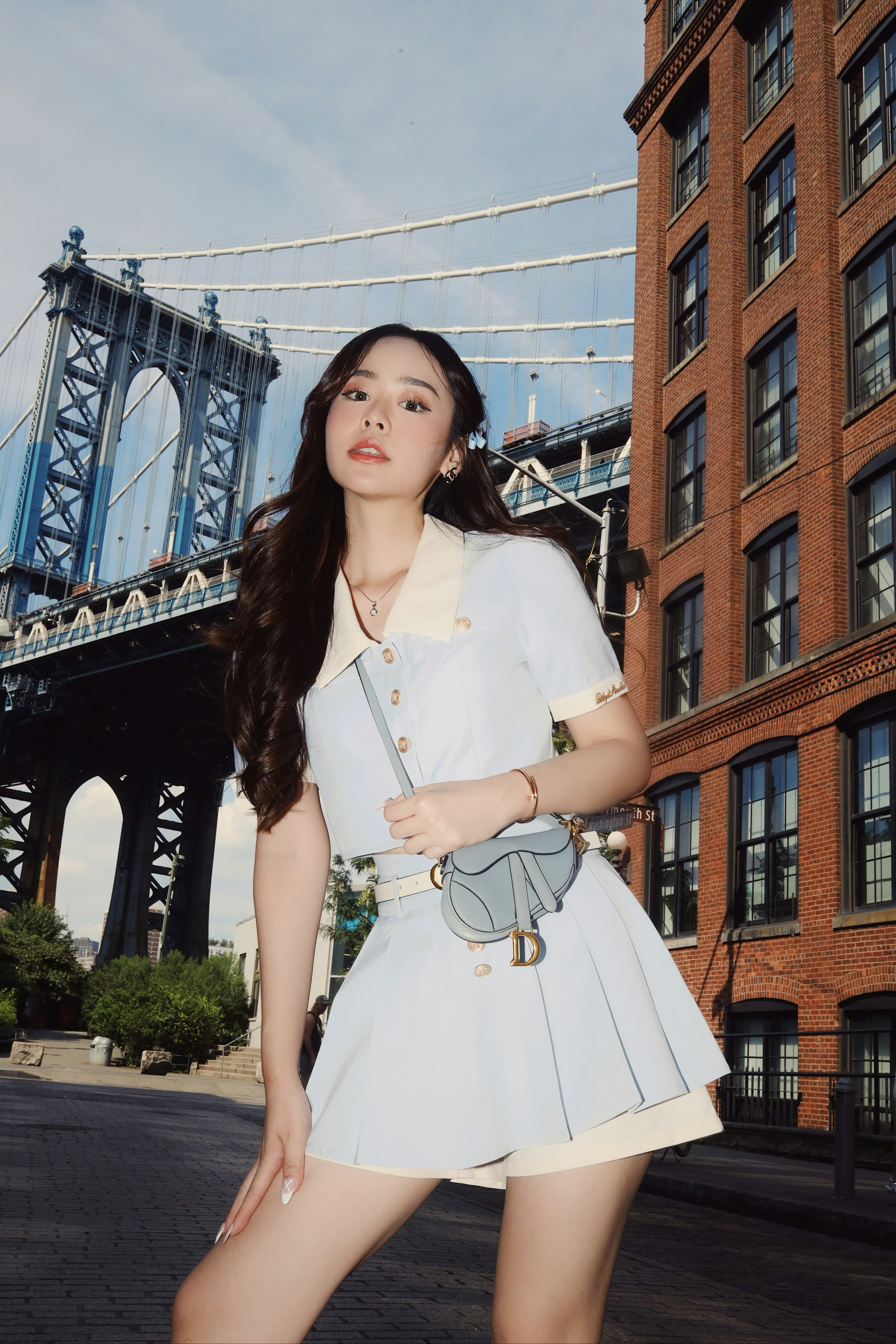 Pastel Chic Under a City Bridge: A Portrait Between Brick and Blue Steel