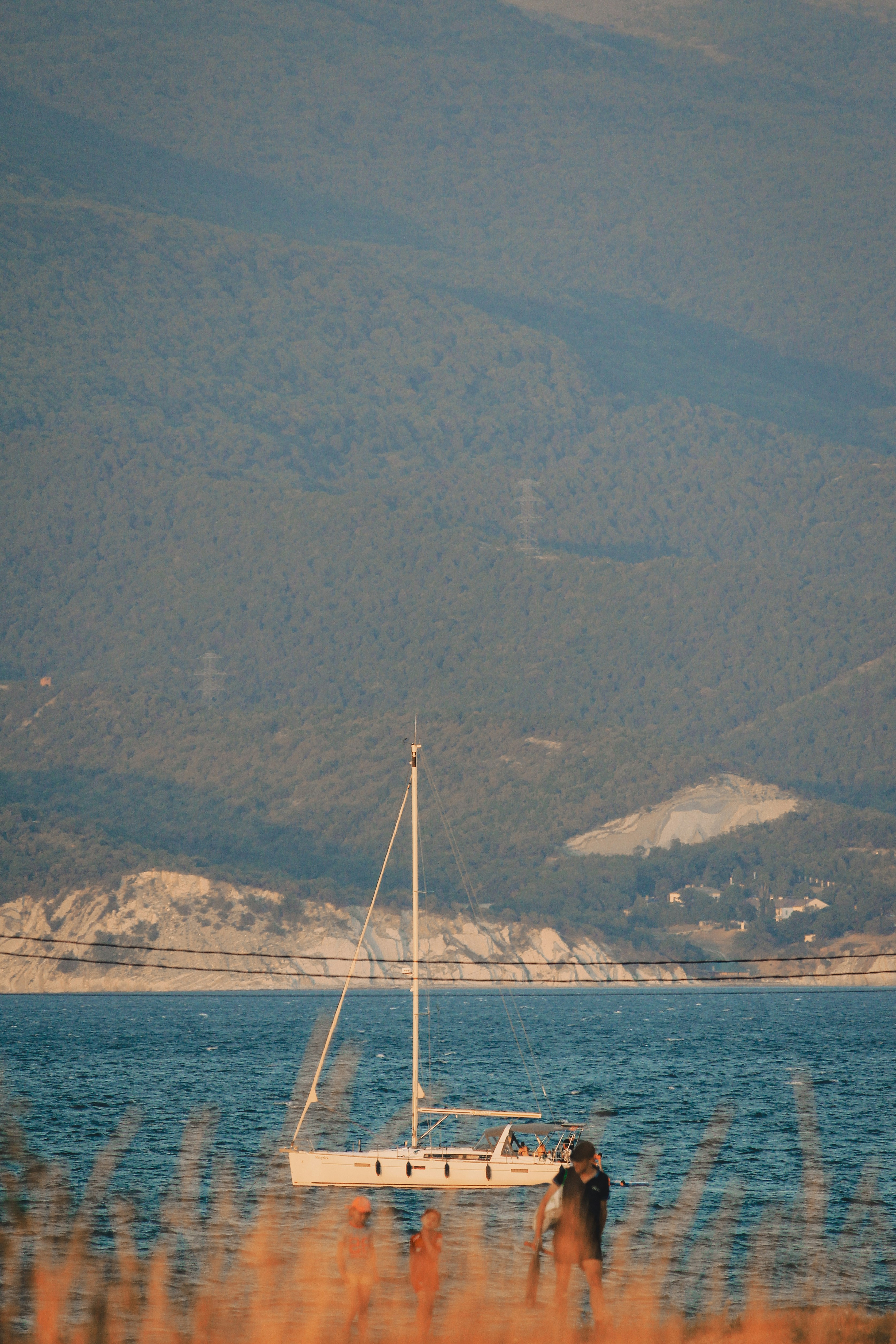 Mast Against the Hills: A Quiet Coastal Moment