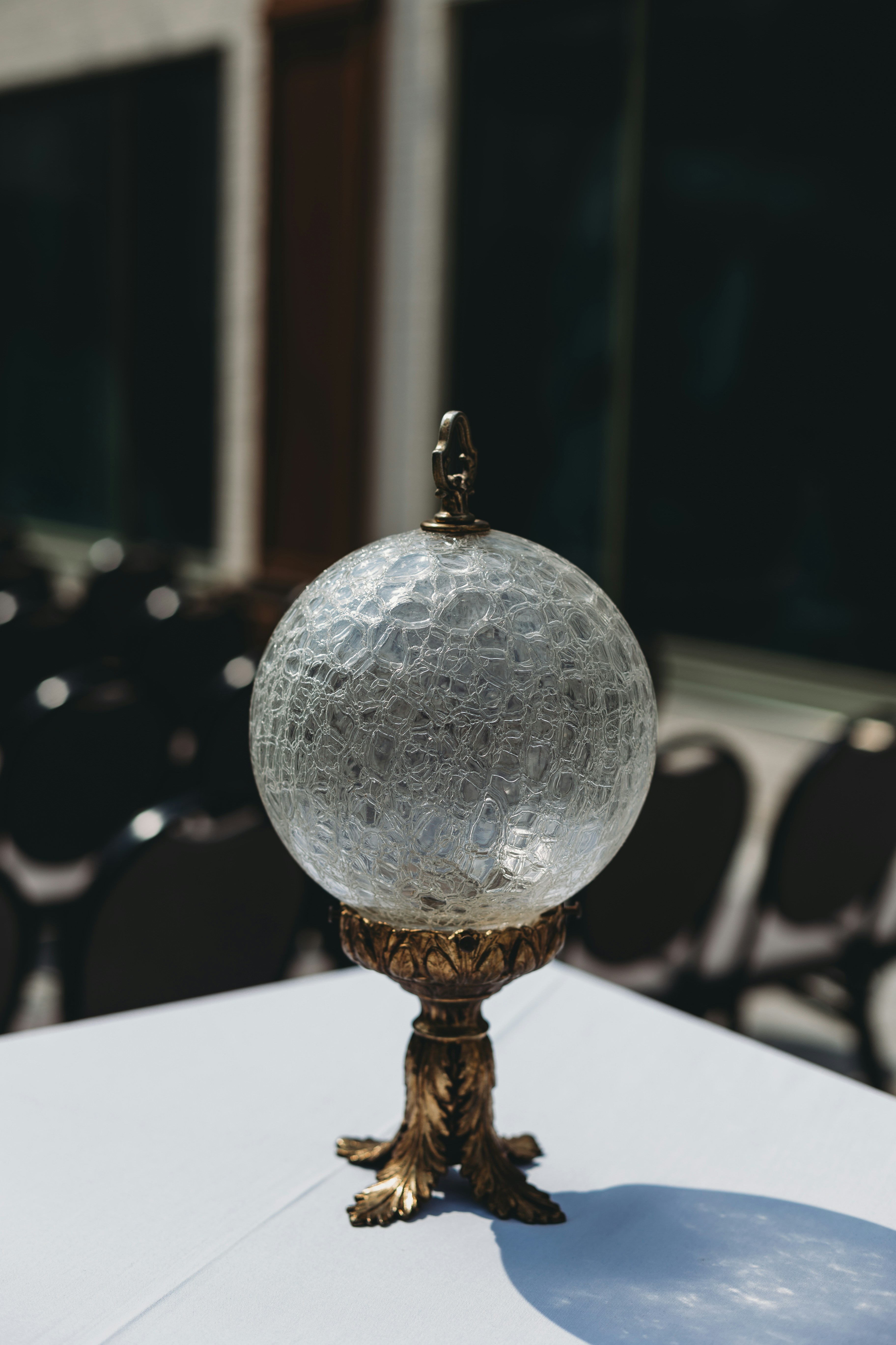 A glass ball on top of a white table photo – Free Hotel Image on Unsplash