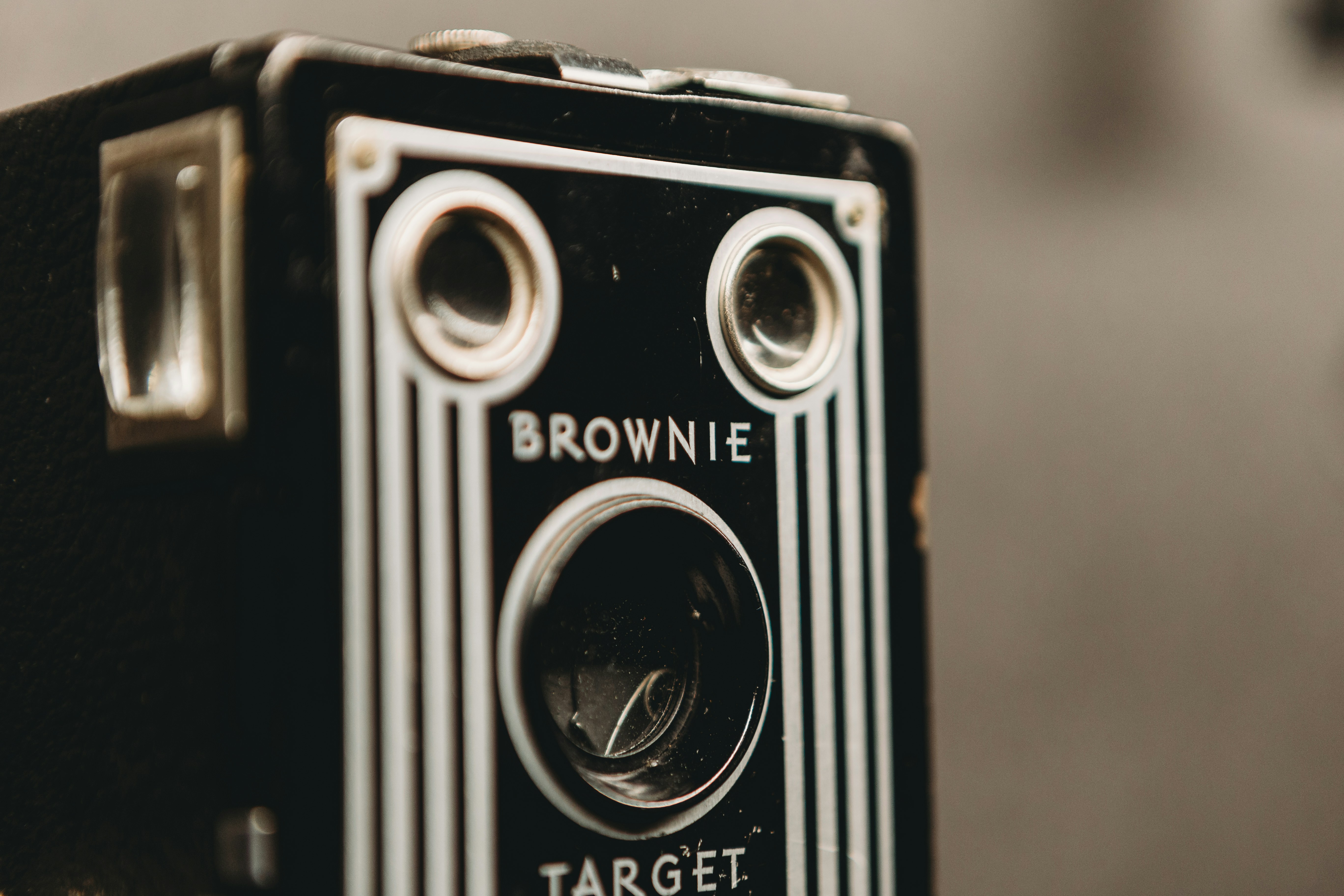Close-Up of a Vintage Brownie Target Box Camera with Weathered Metal and Glass Lens