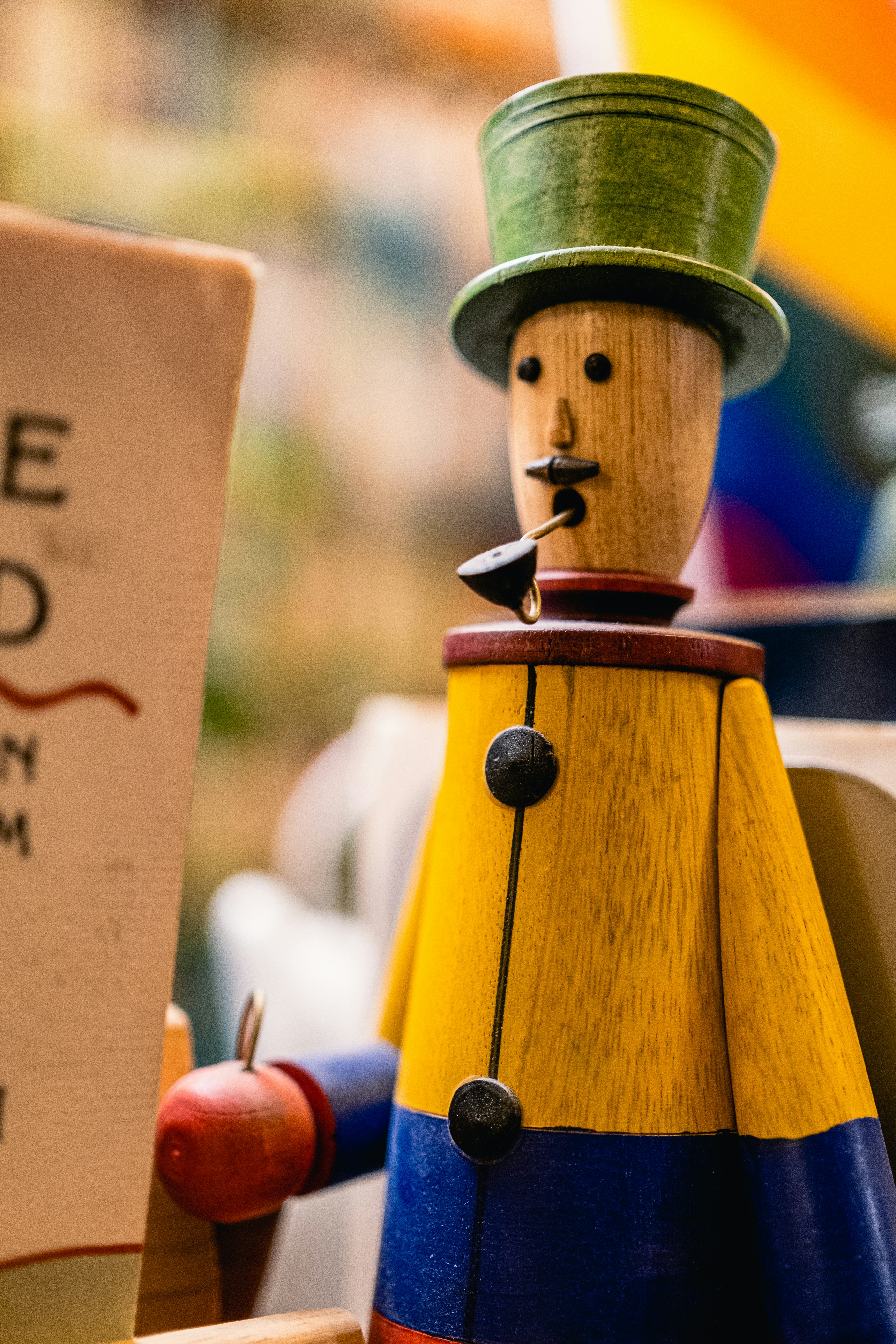 A wooden toy with a green hat and mustache photo – Free Figurine Image ...