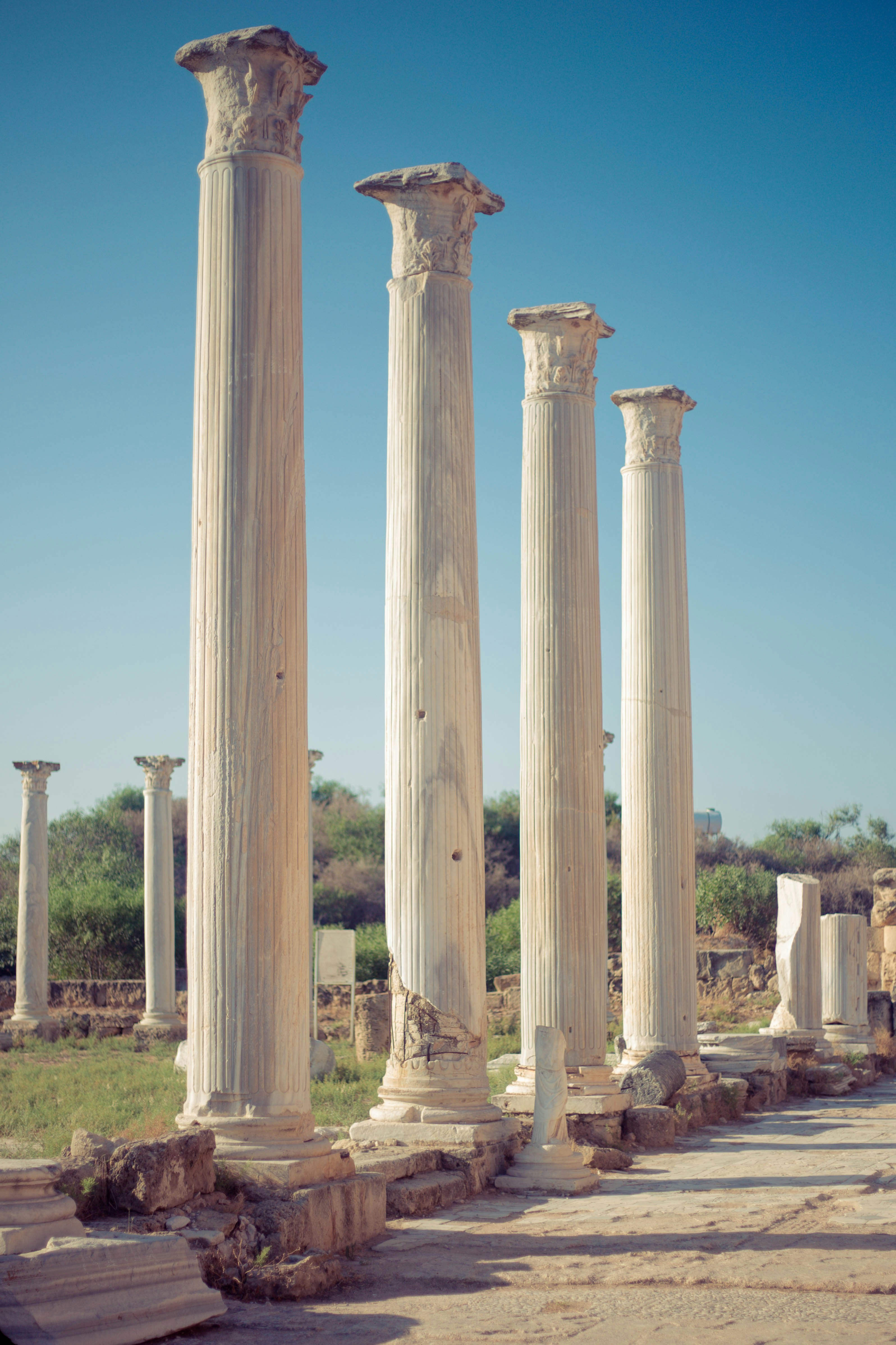 A row of white pillars sitting next to each other photo – Free Ruins ...