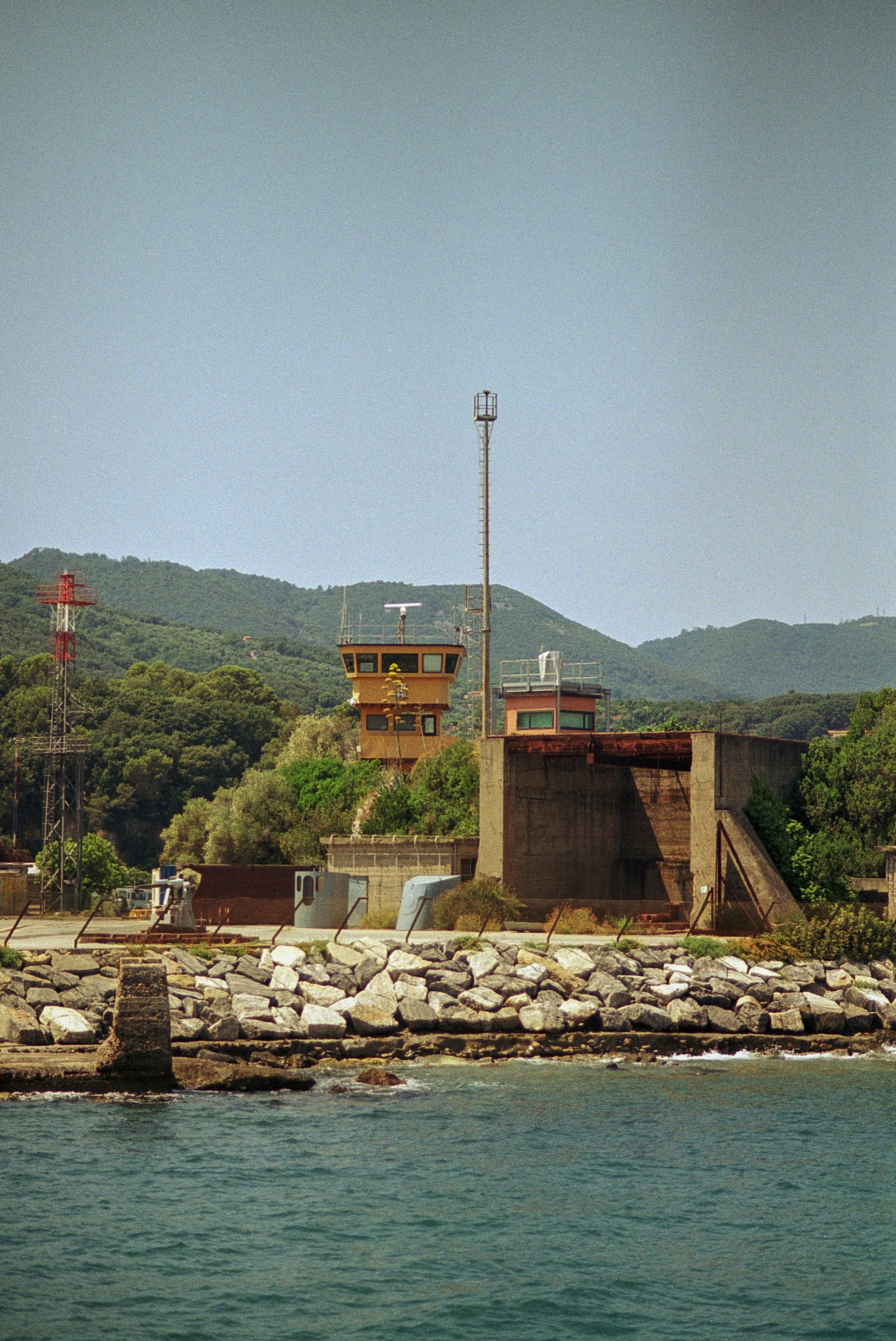 Breakwater Sentinel: A Coastal Control Tower Against a Quiet Hillside