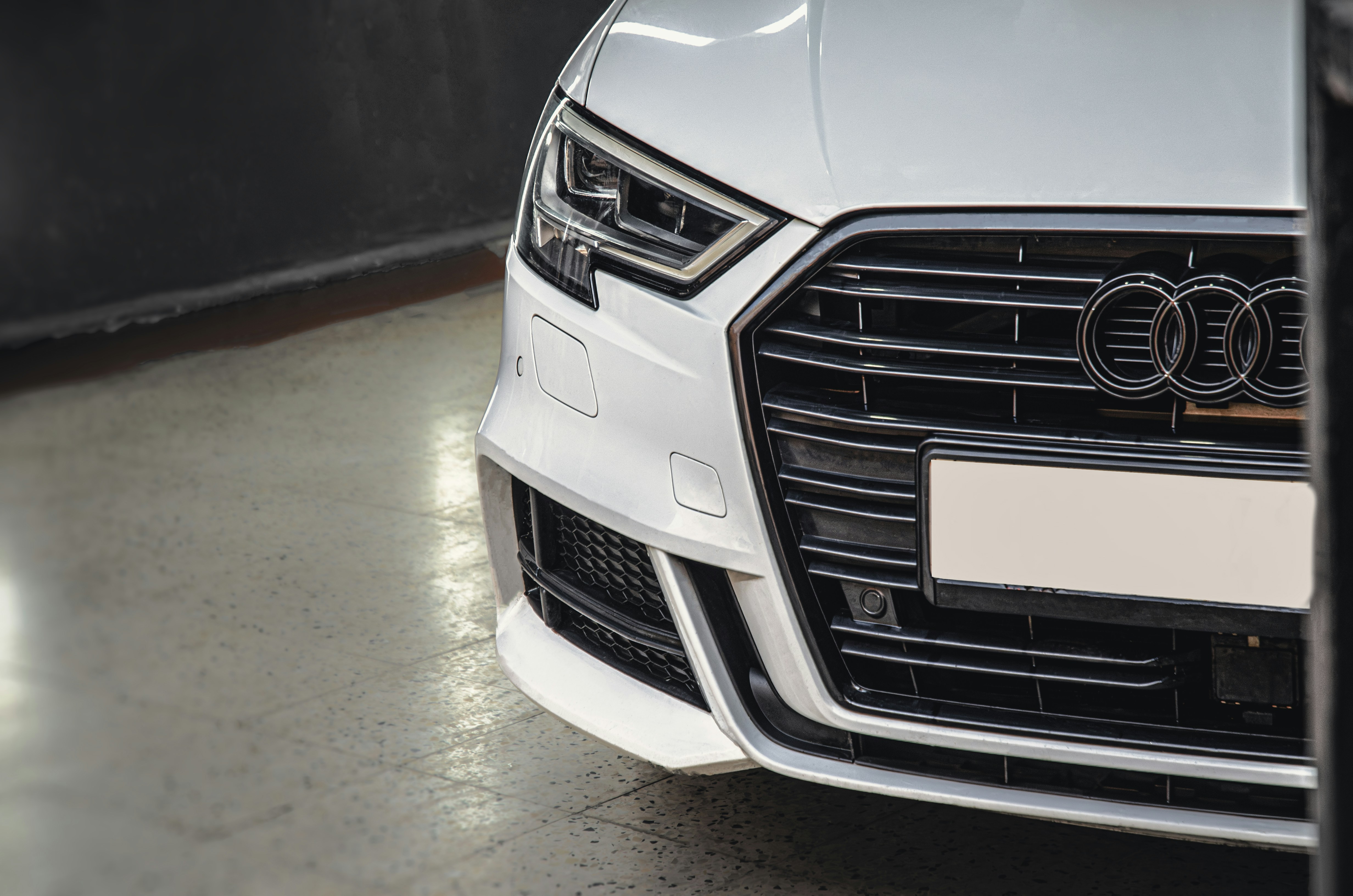 A close up of the front grille of a white car photo – Free Audi Image ...
