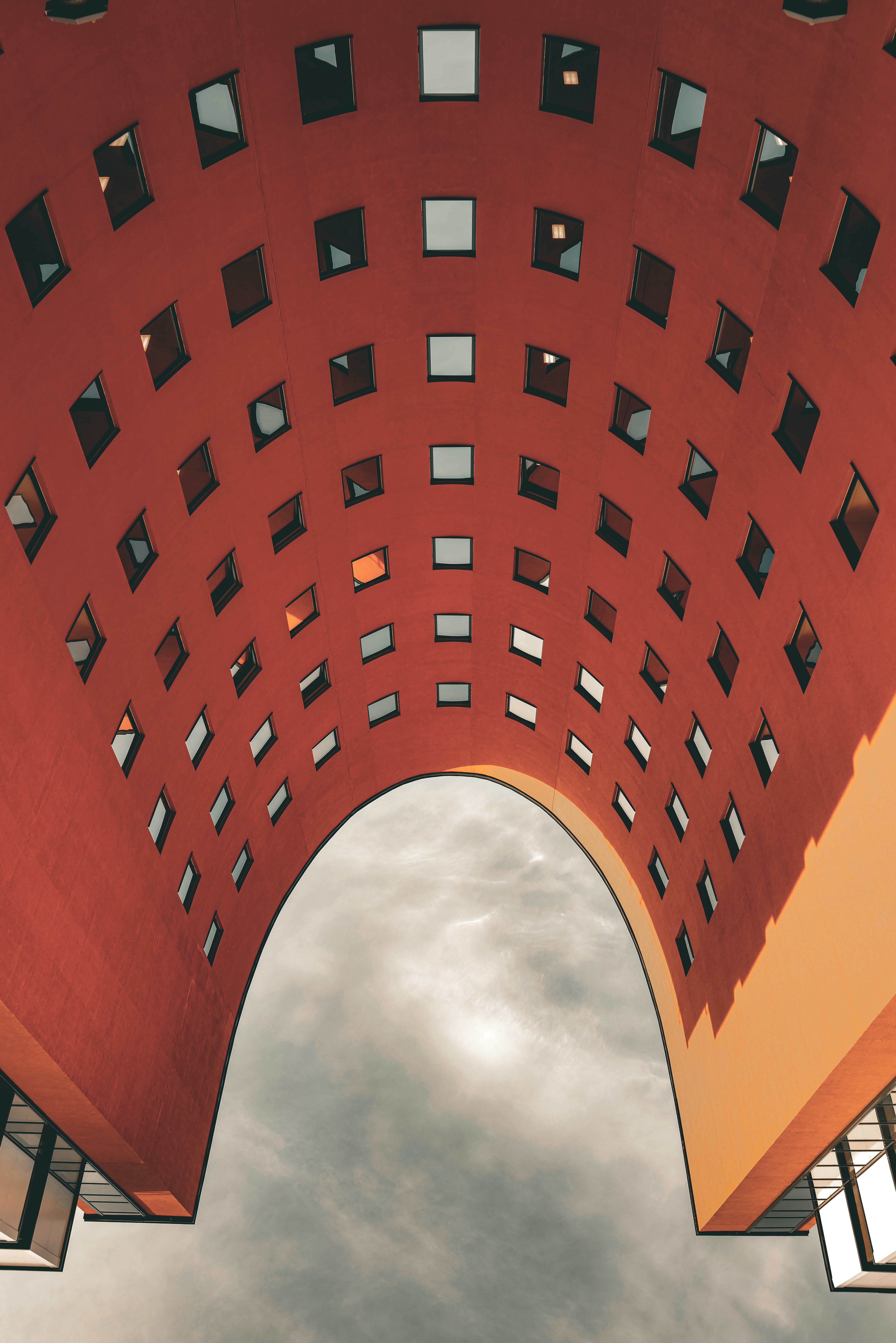A very tall red building with lots of windows photo – Free Russia Image ...
