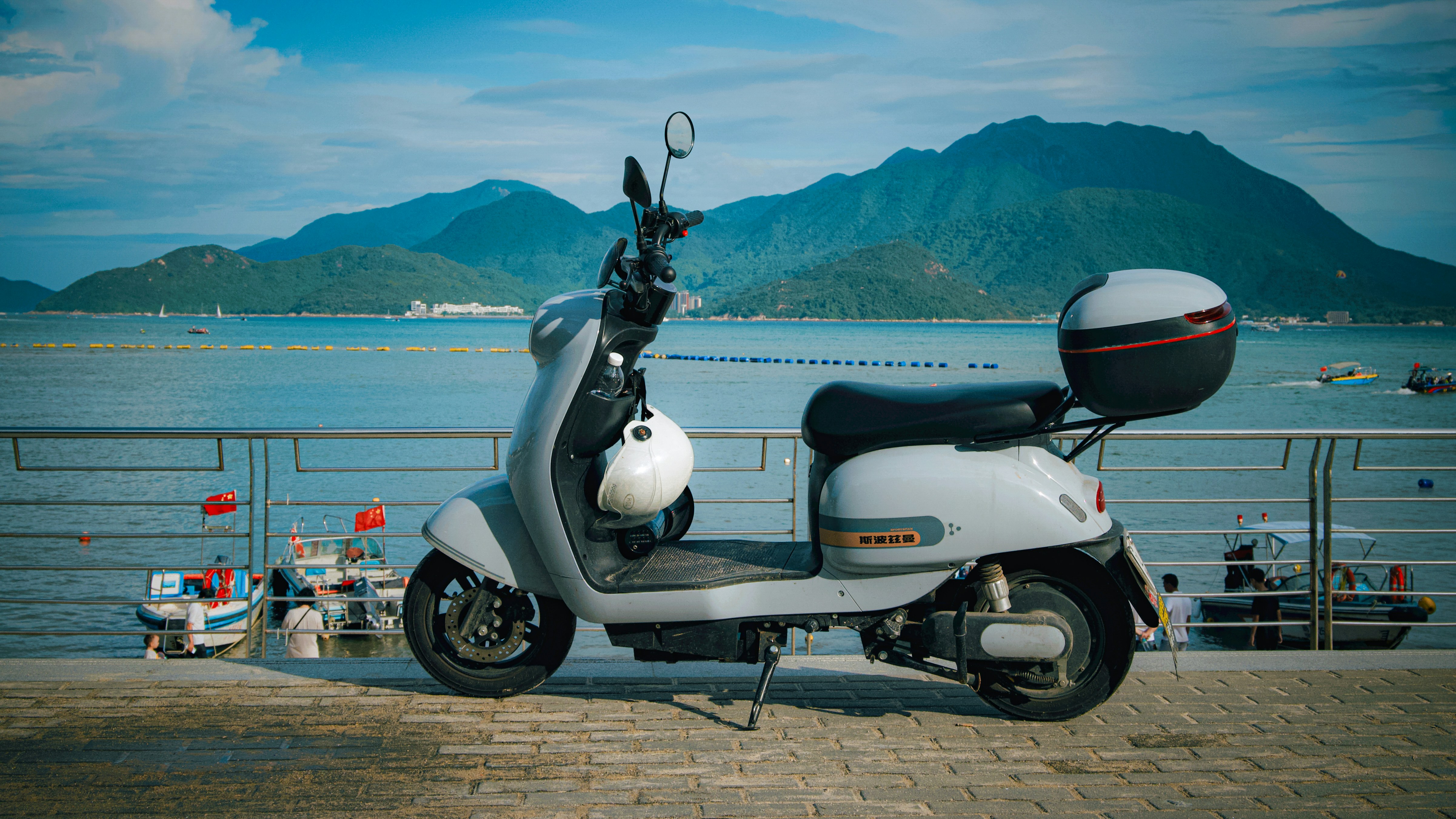 a motor scooter parked on the side of the road