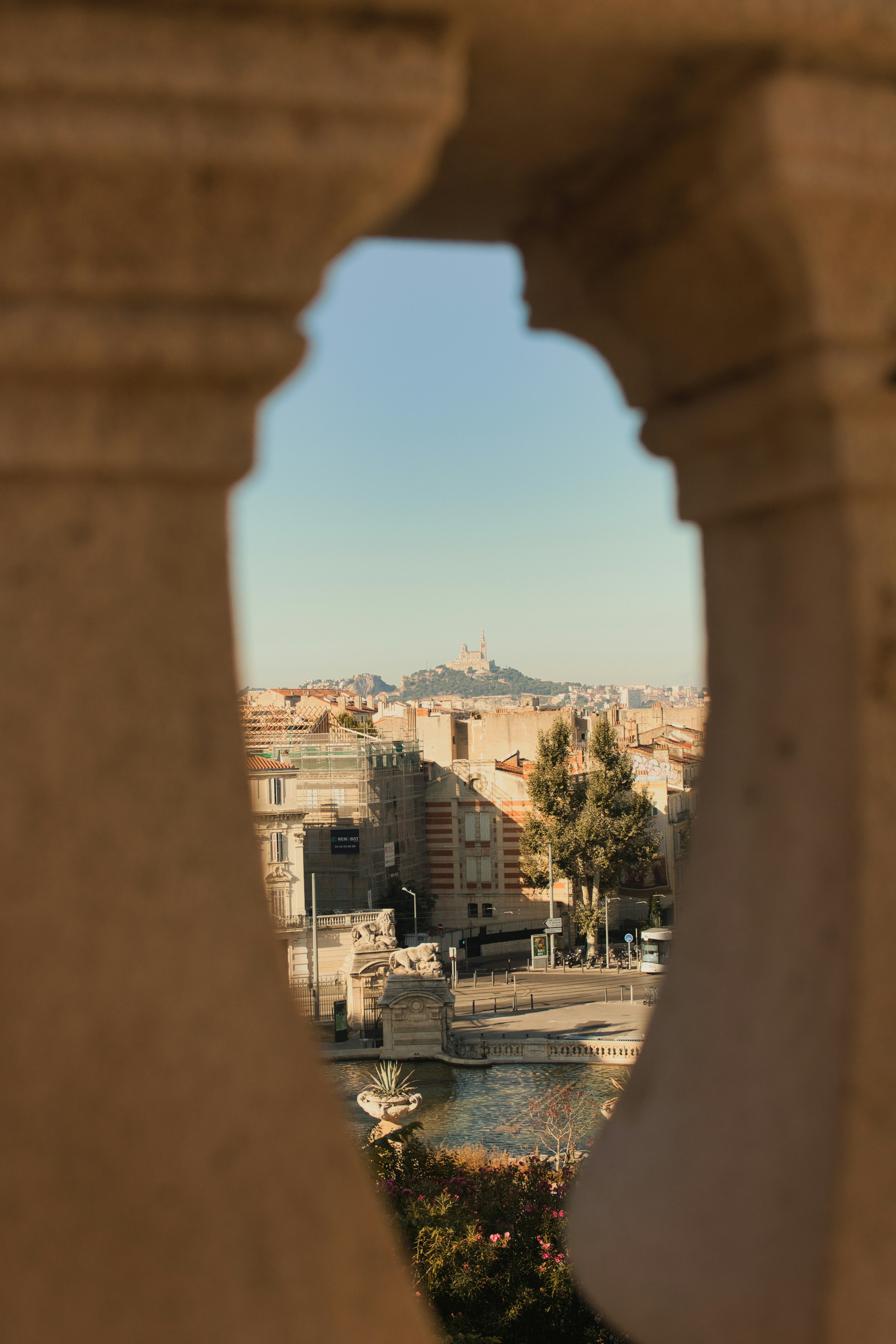 Through the Stone Arch: A Quiet Cityscape Framed