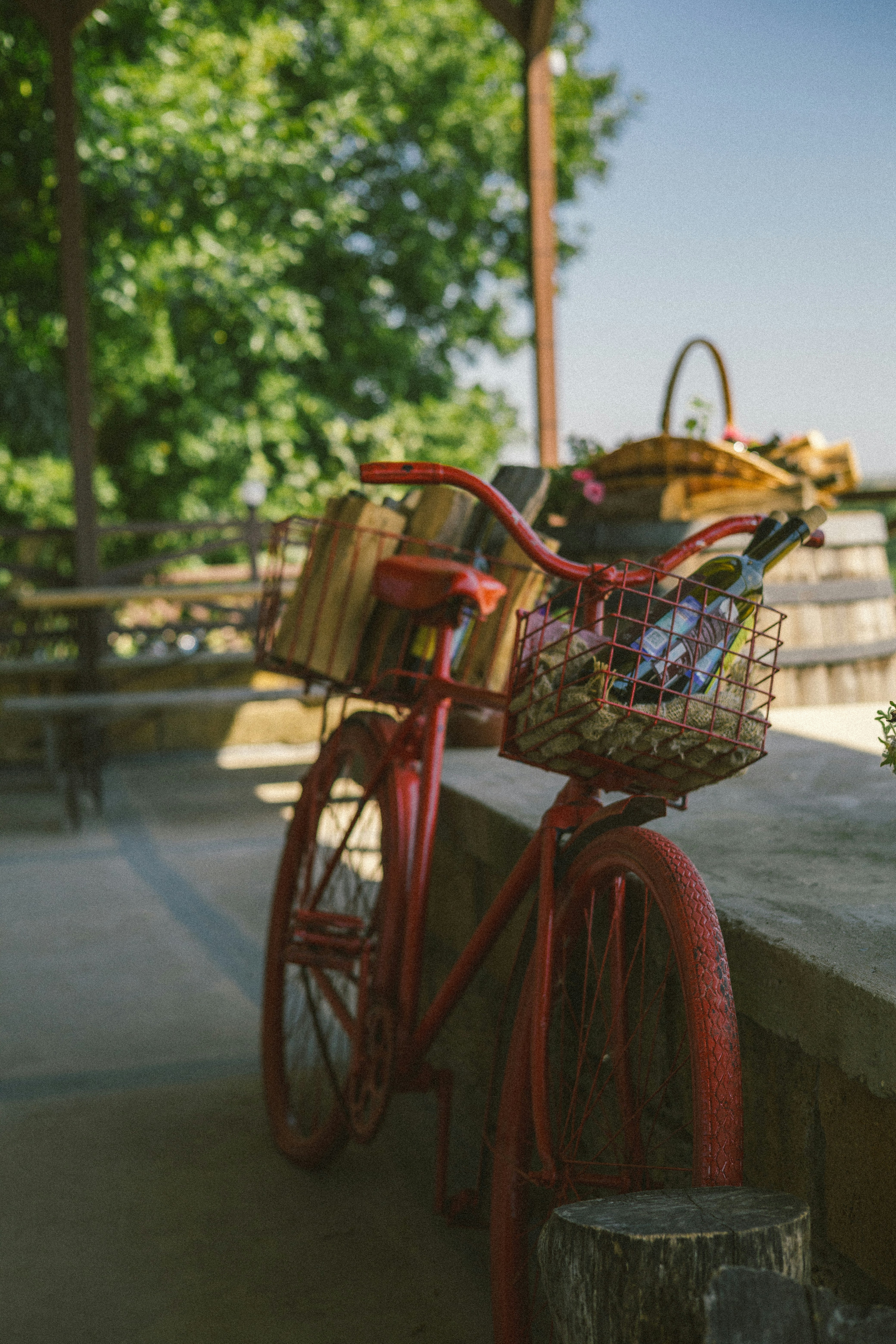 Red Bicycle with Basket of Goods in Afternoon Light