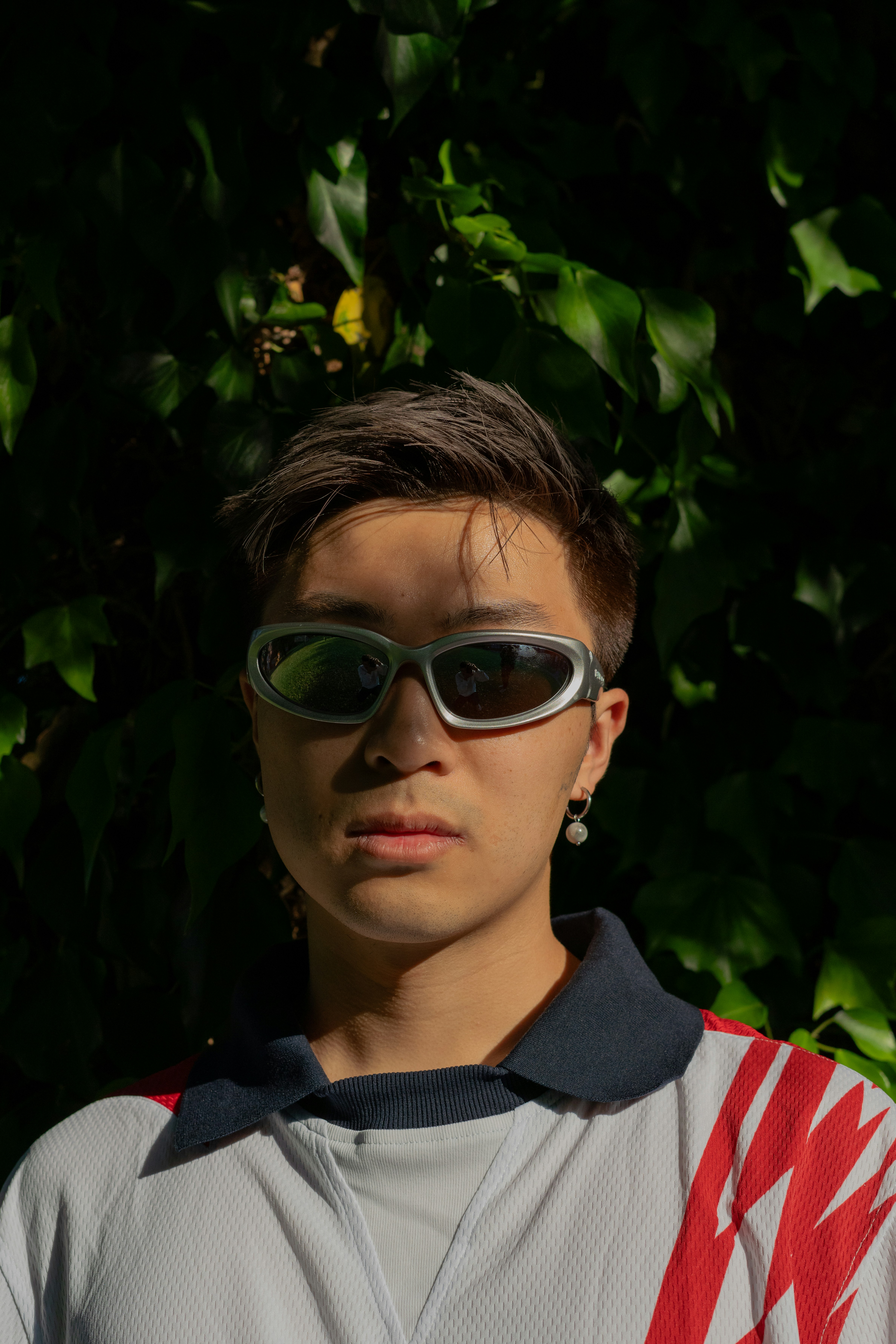 Gaze Through the Green Veil: A Portrait in Dappled Light