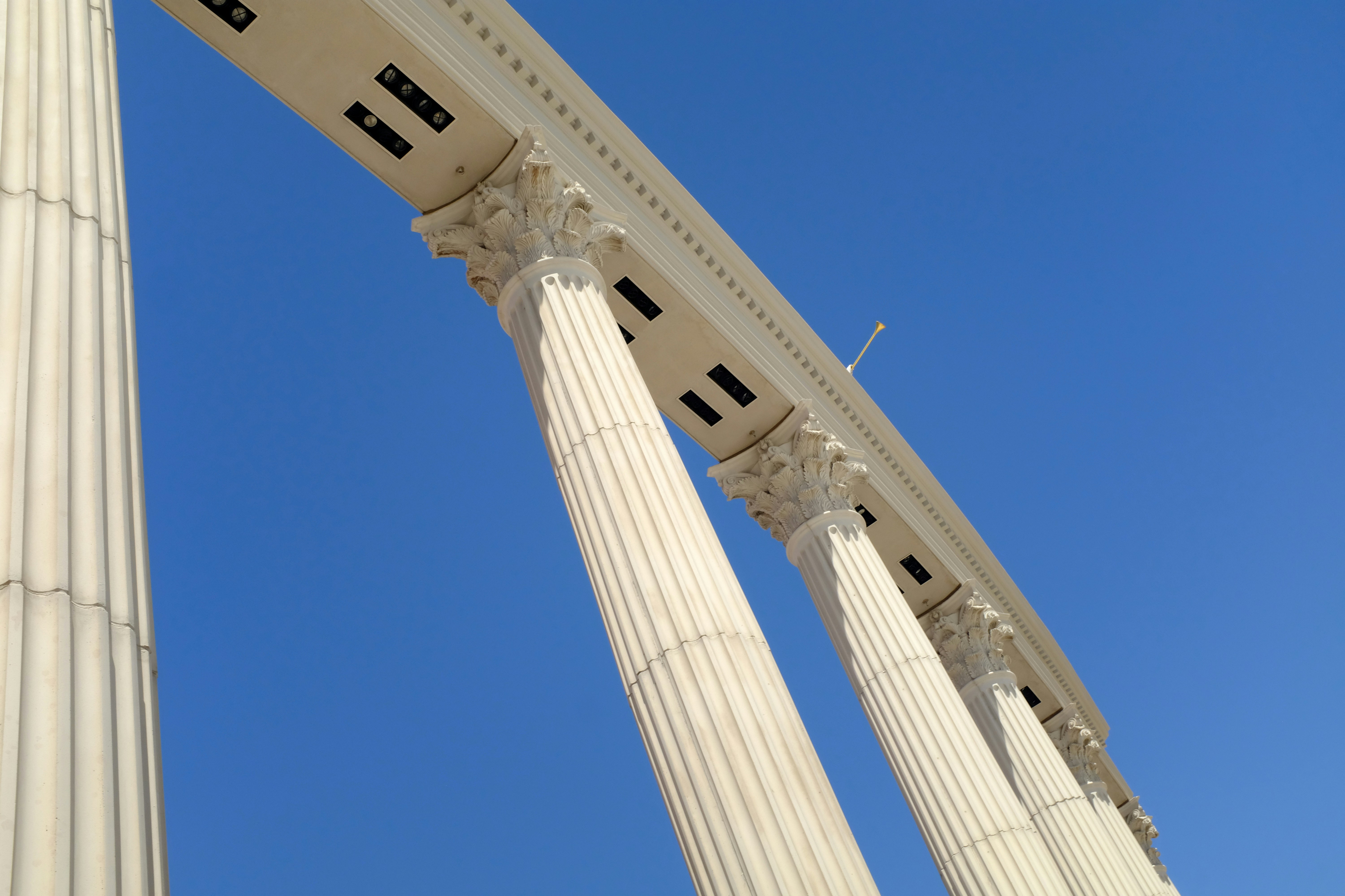 A tall white column with a clock on it's side photo – Free Las vegas ...