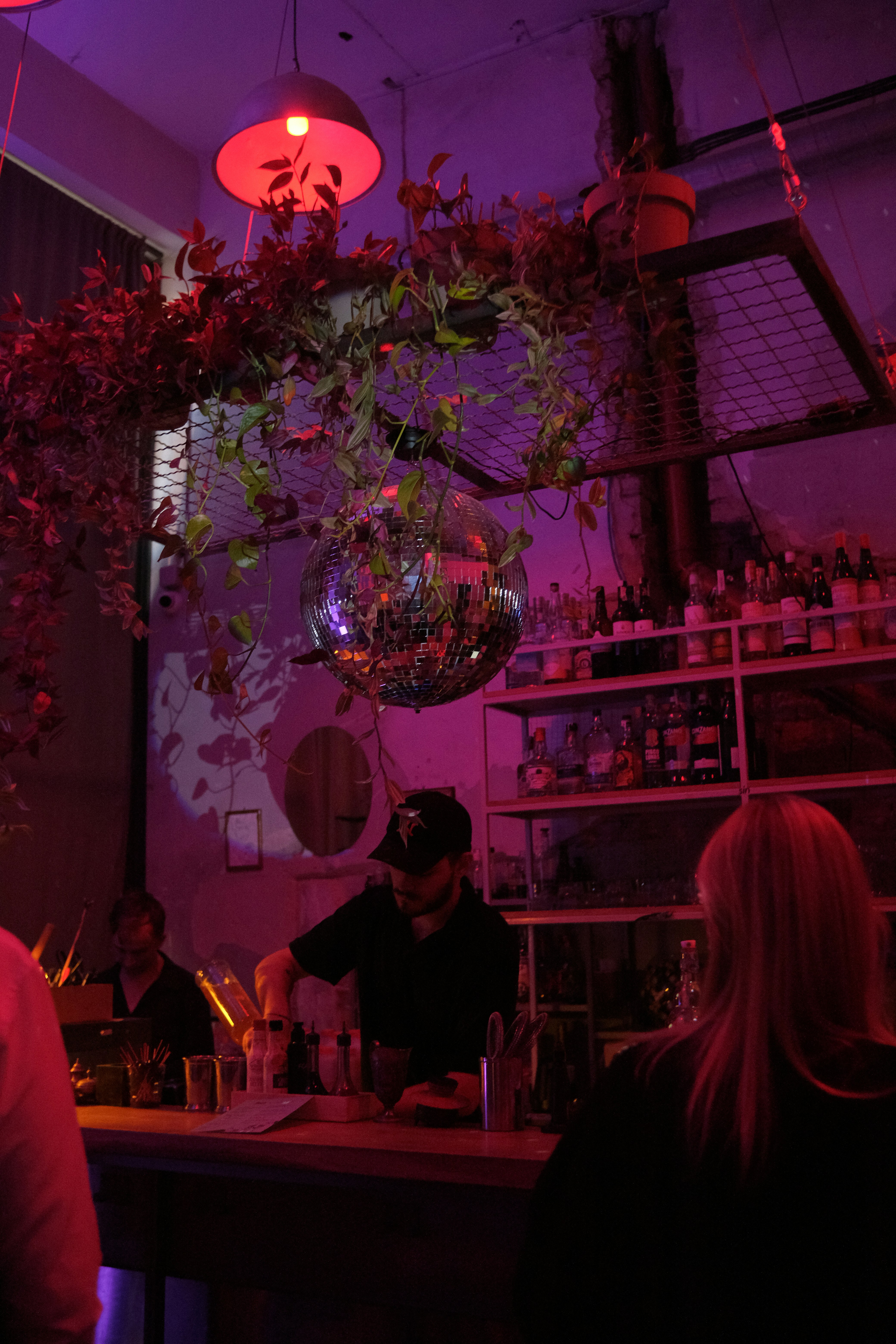 a group of people sitting at a bar