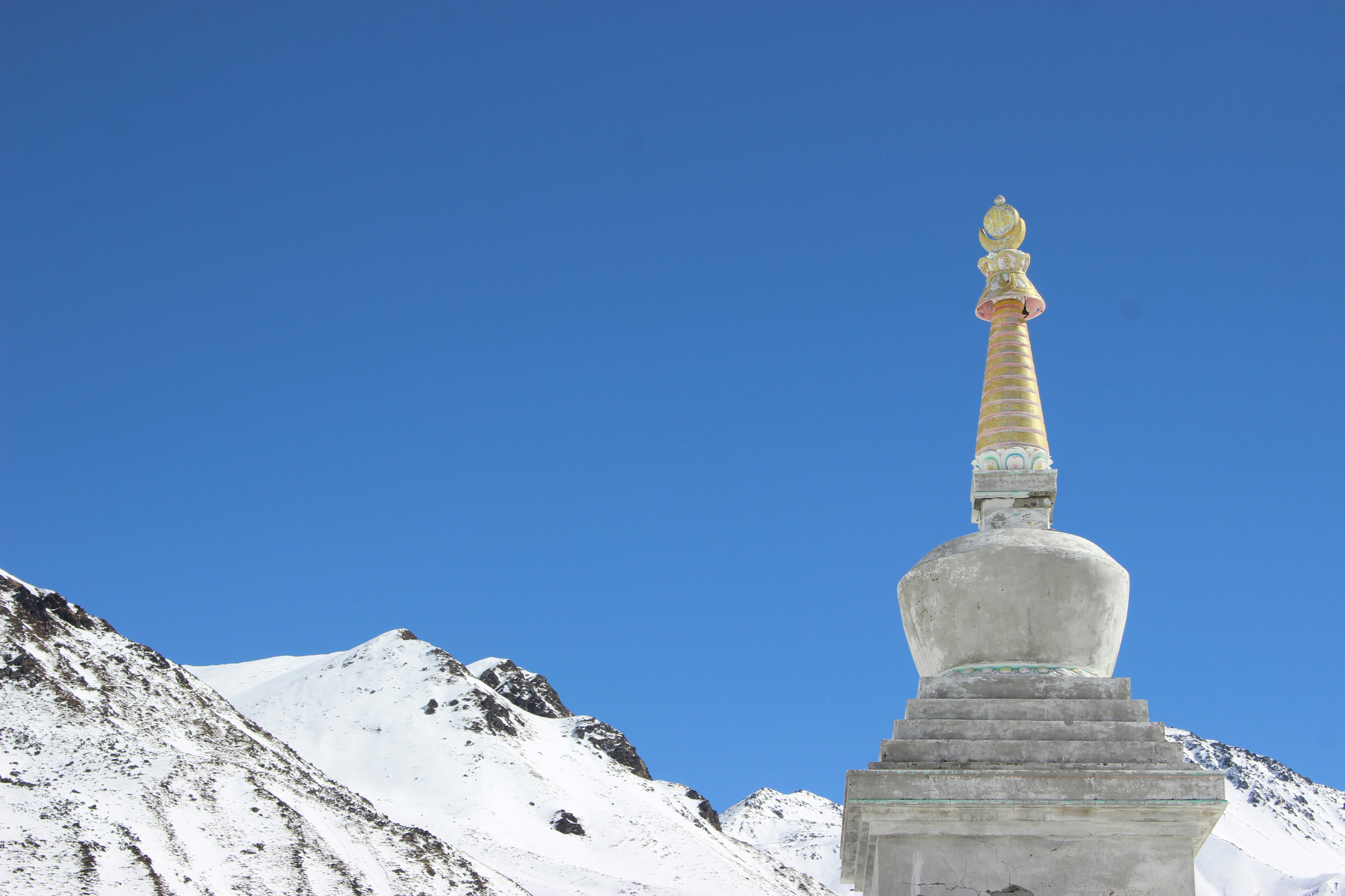 Winter Monastic Spire on a Snow-Laden Ridge