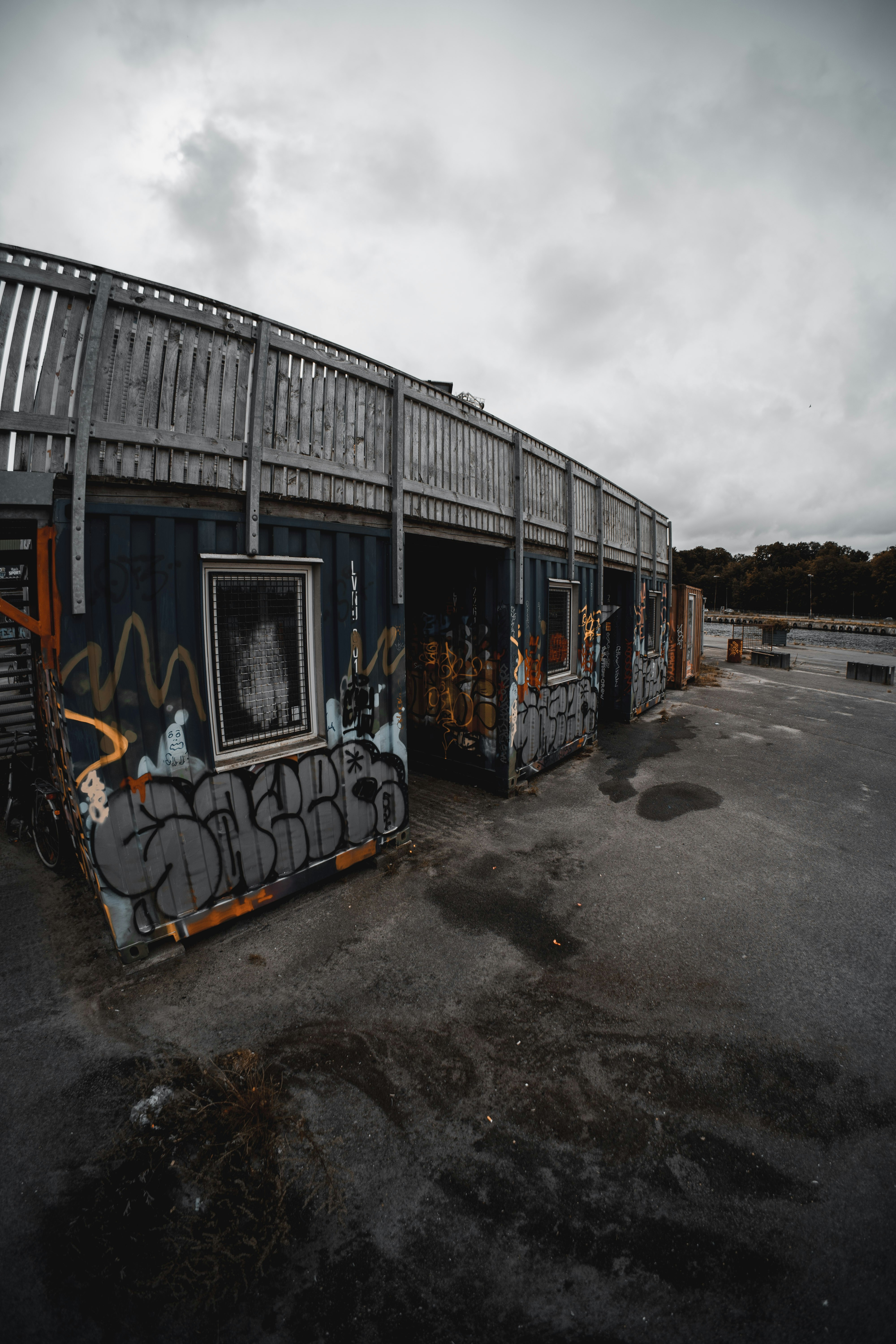 Rooftop Graffiti Depot Beneath a Moody Sky