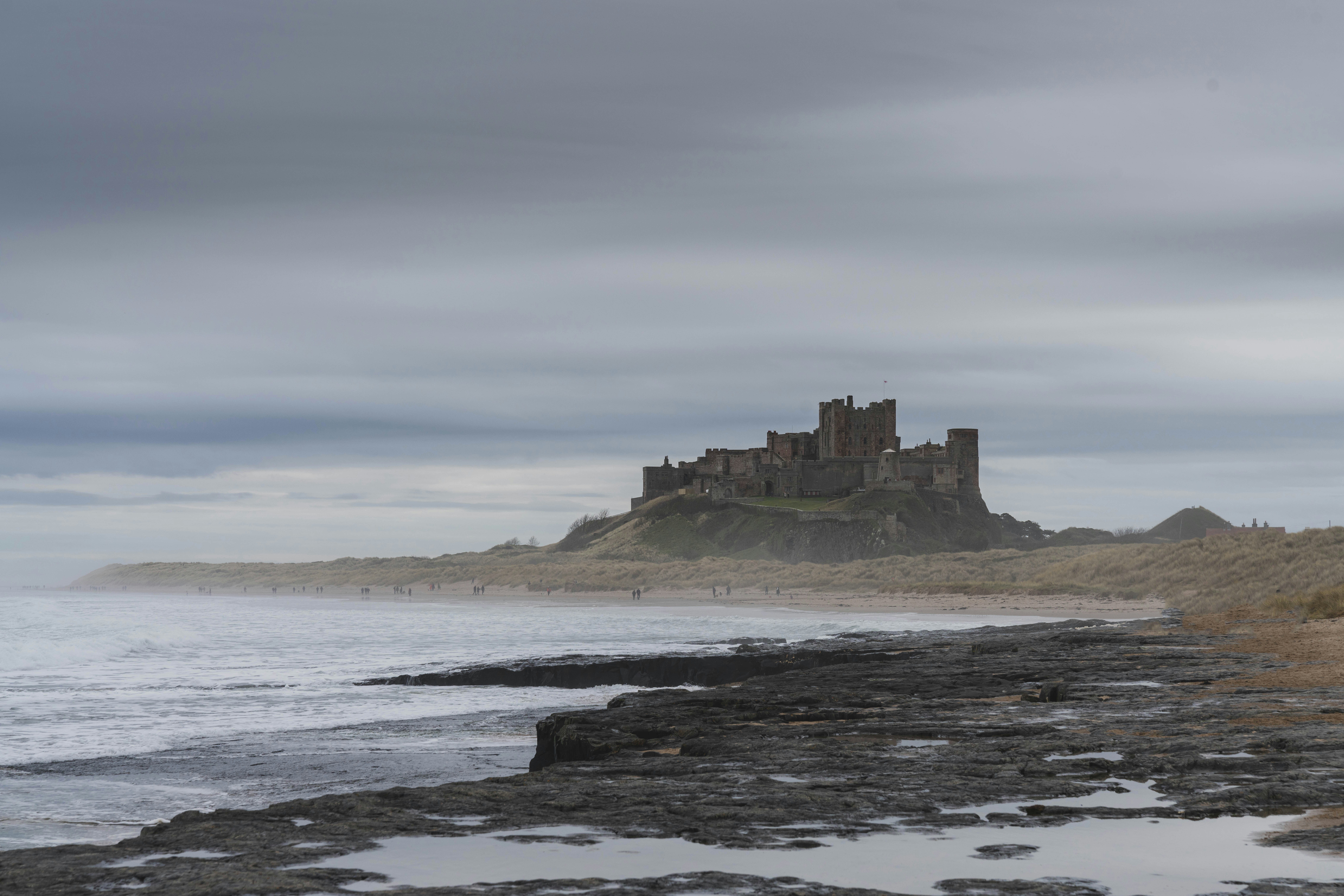 Castle in the Mist: A lone fortress rising from a slate shore