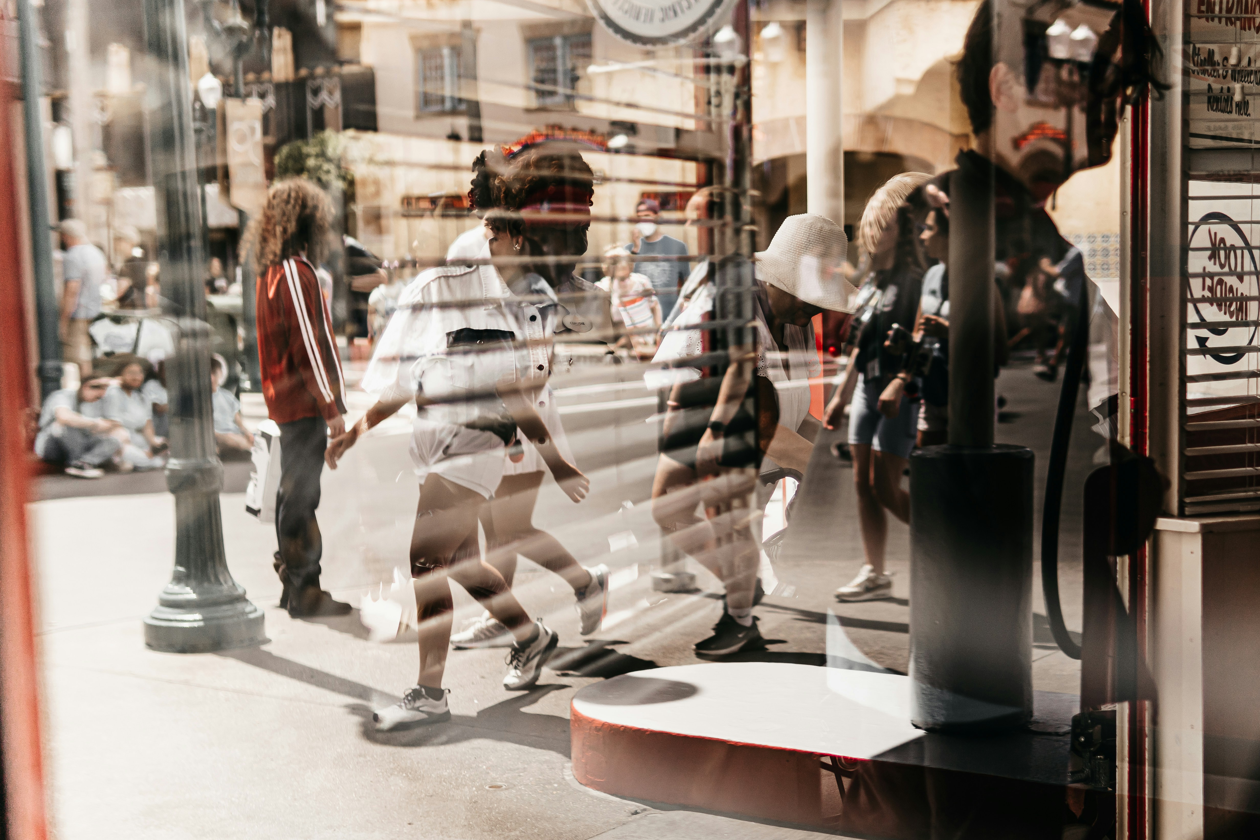 Crosswalk Echoes in a Glass Shopfront