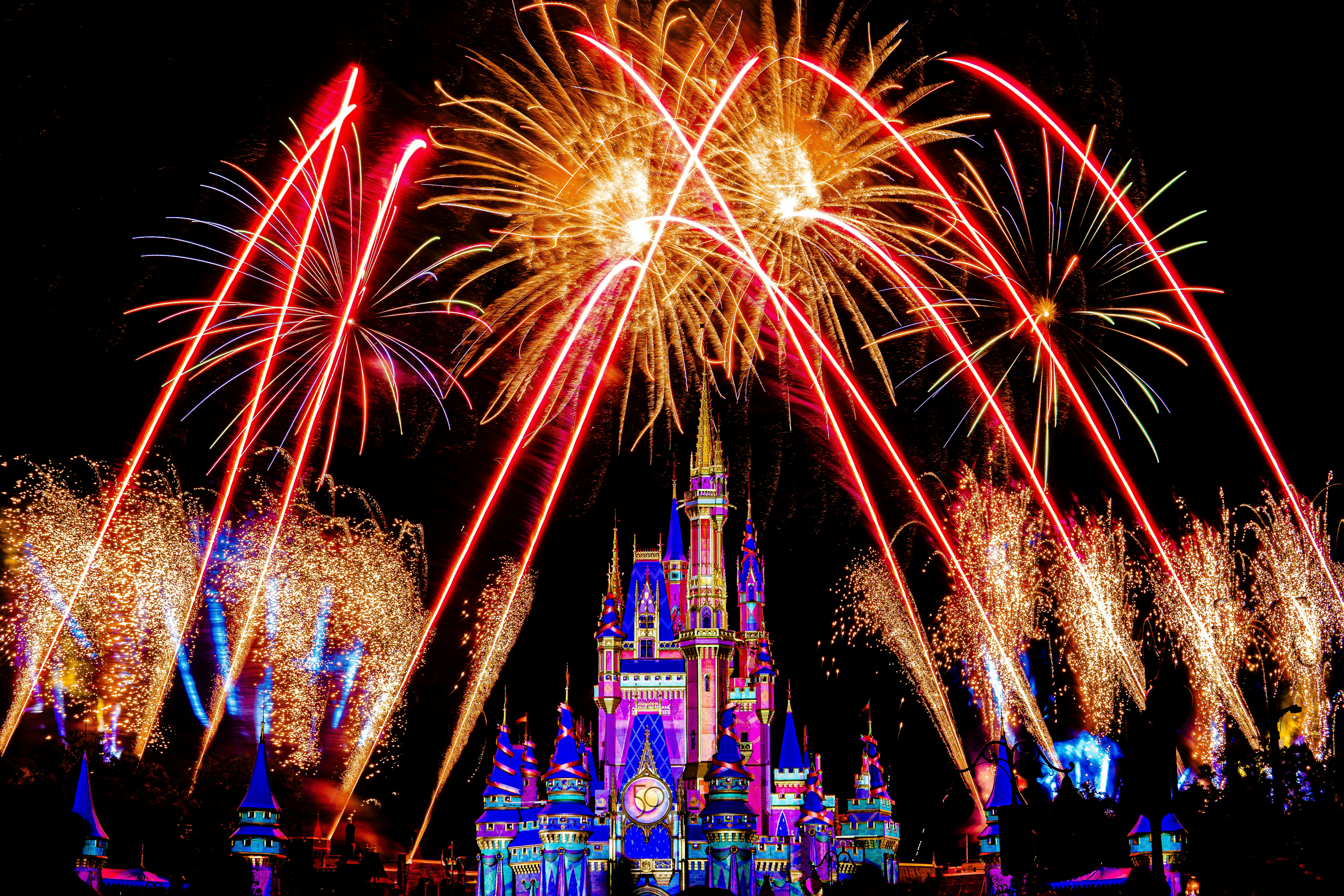 A castle with a lot of fireworks in the sky photo – Free New year's ...