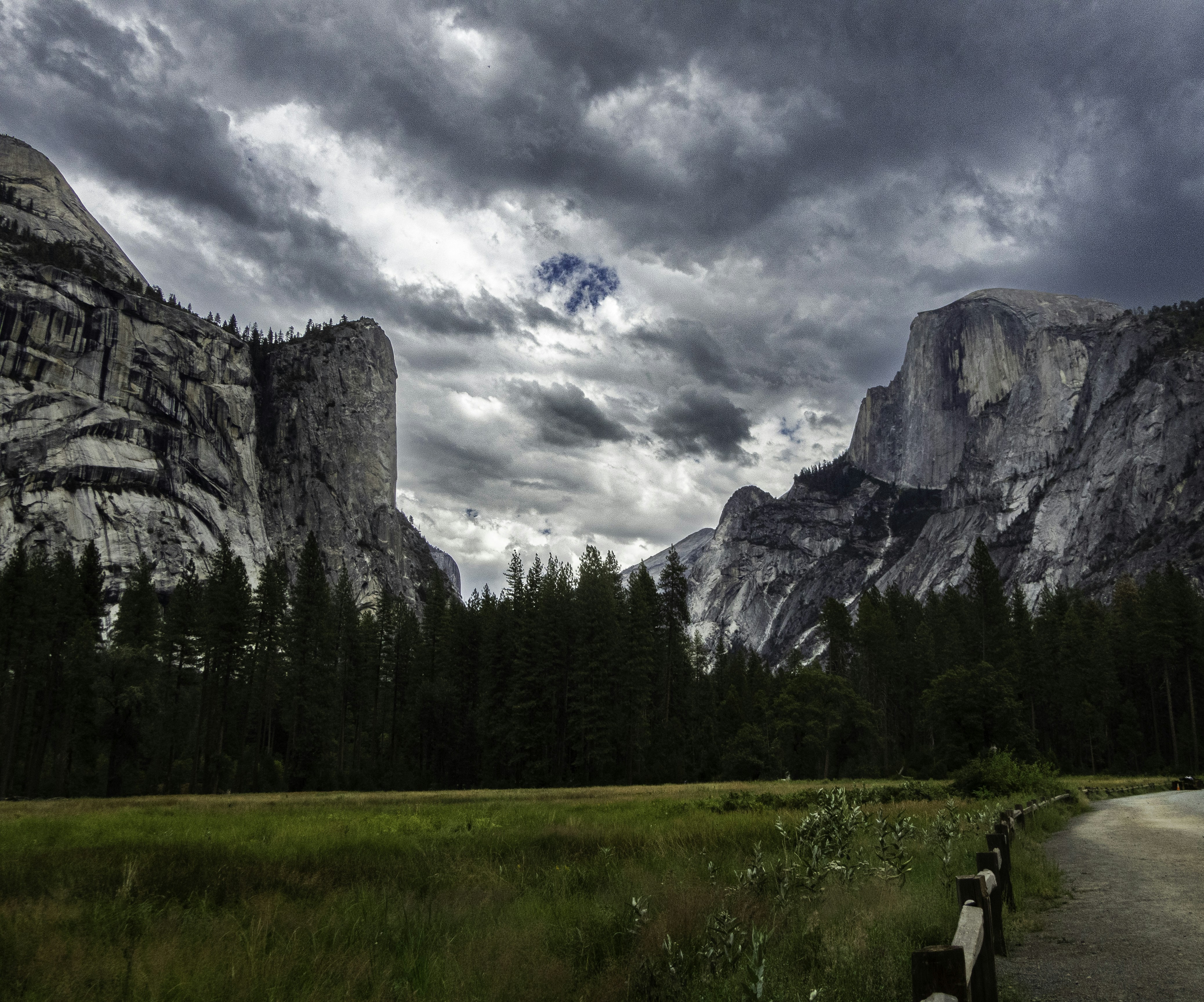 A scenic view of a mountain range with a cloudy sky photo – Free ...