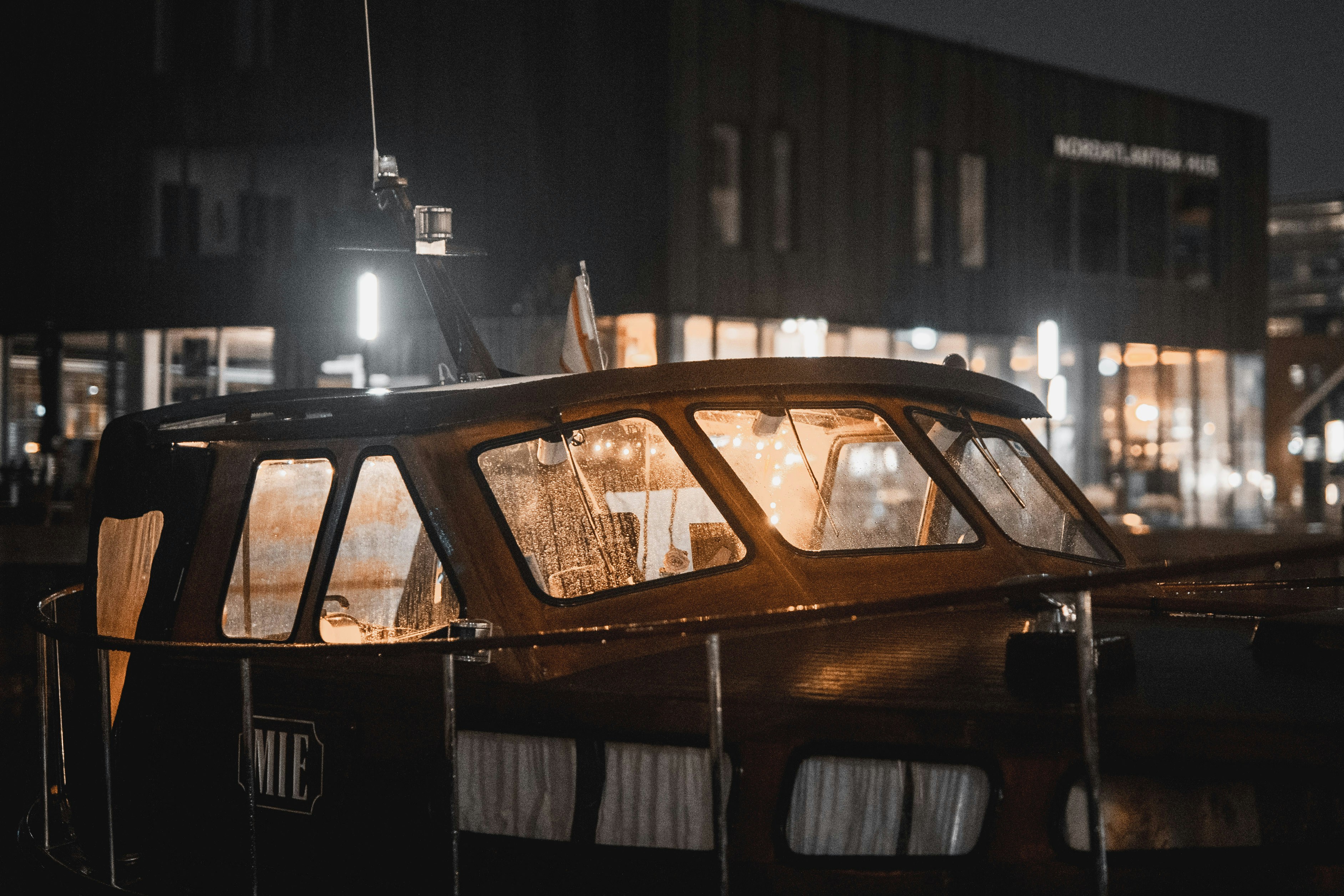 Rain-Washed Hull Under Neon Harbor Lights