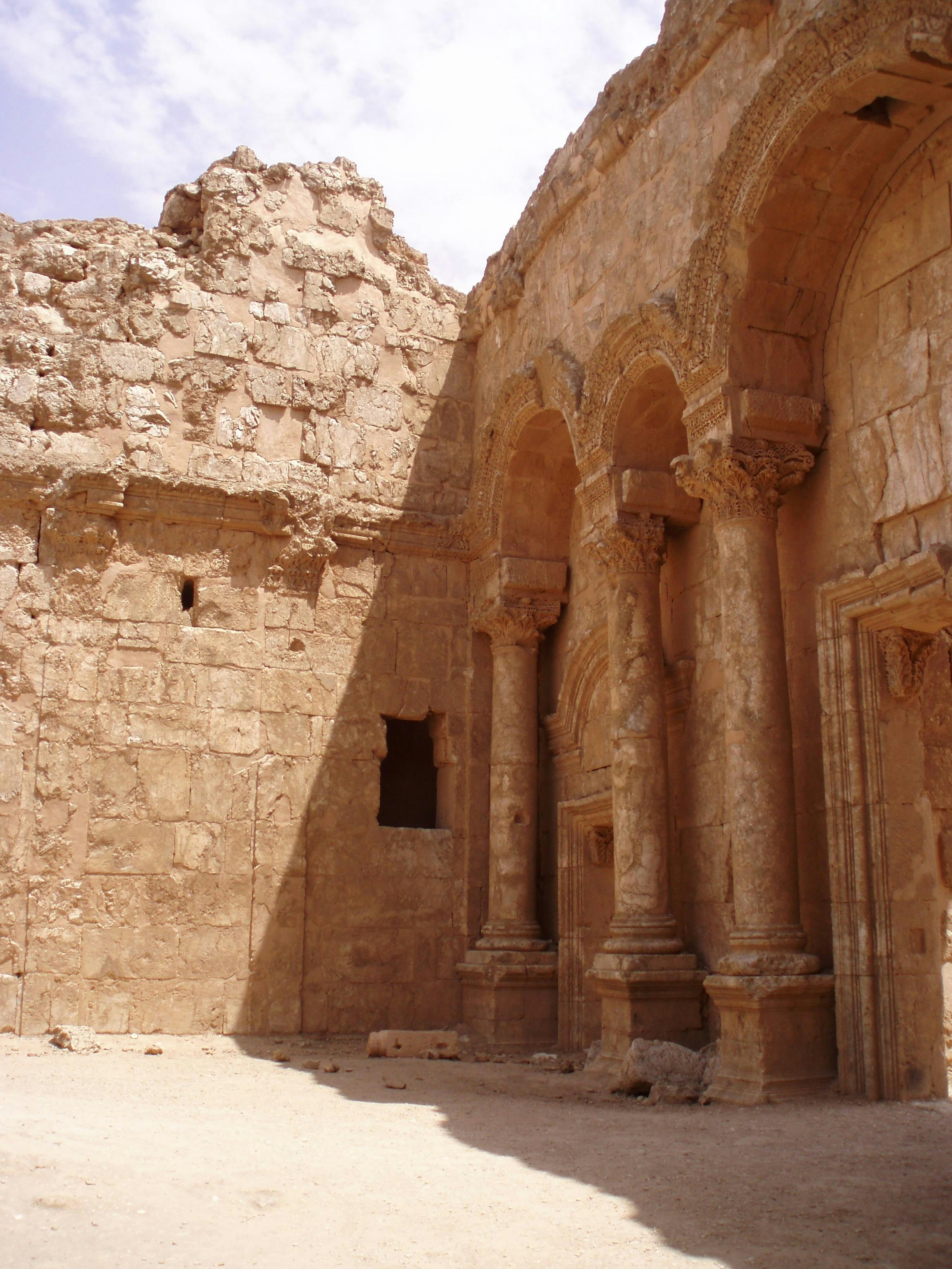A stone building with arches and a doorway photo – Free Syria Image on ...