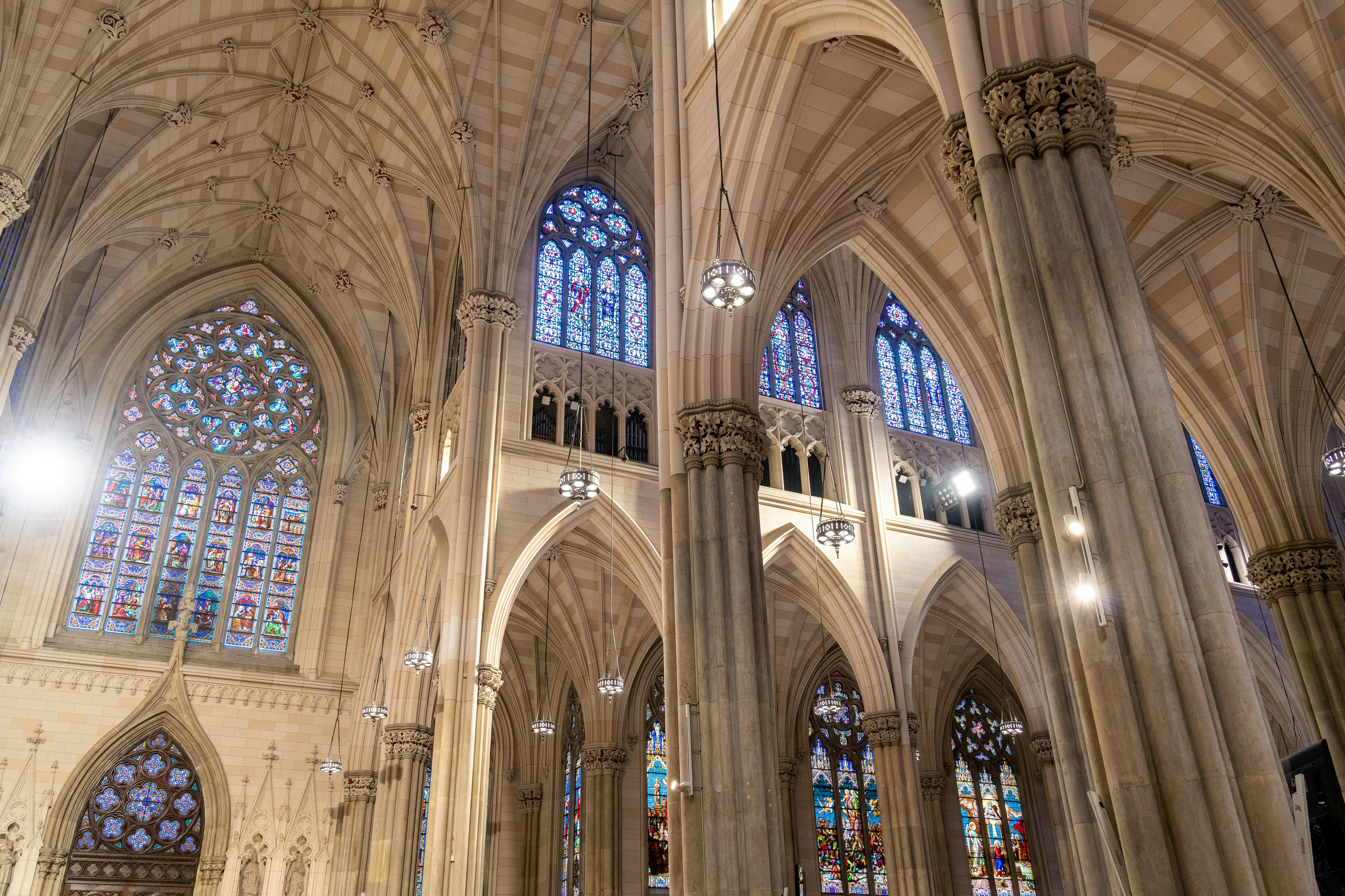 The interior of a large cathedral with stained glass windows photo ...