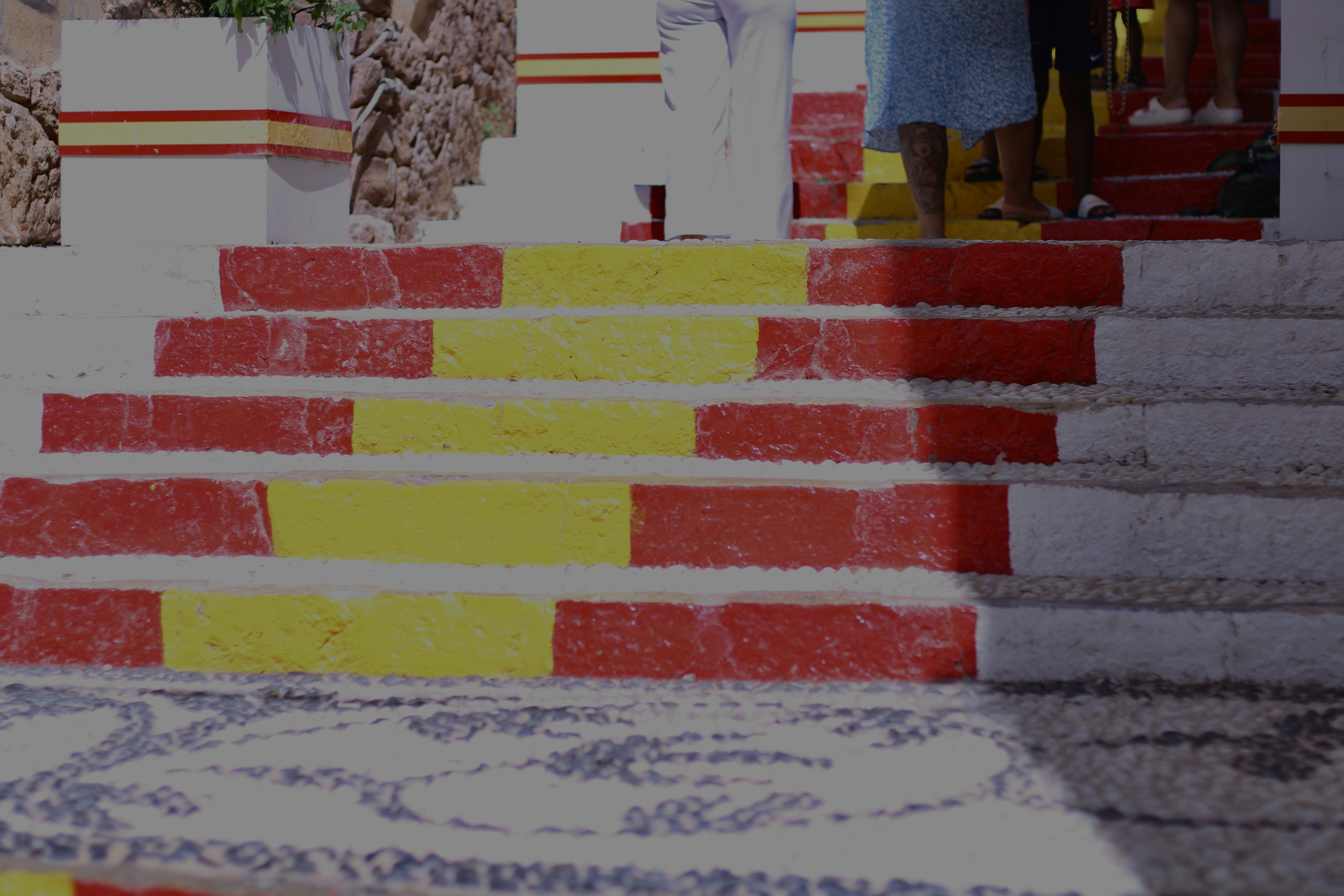 A group of people standing at the top of a set of stairs photo – Free ...