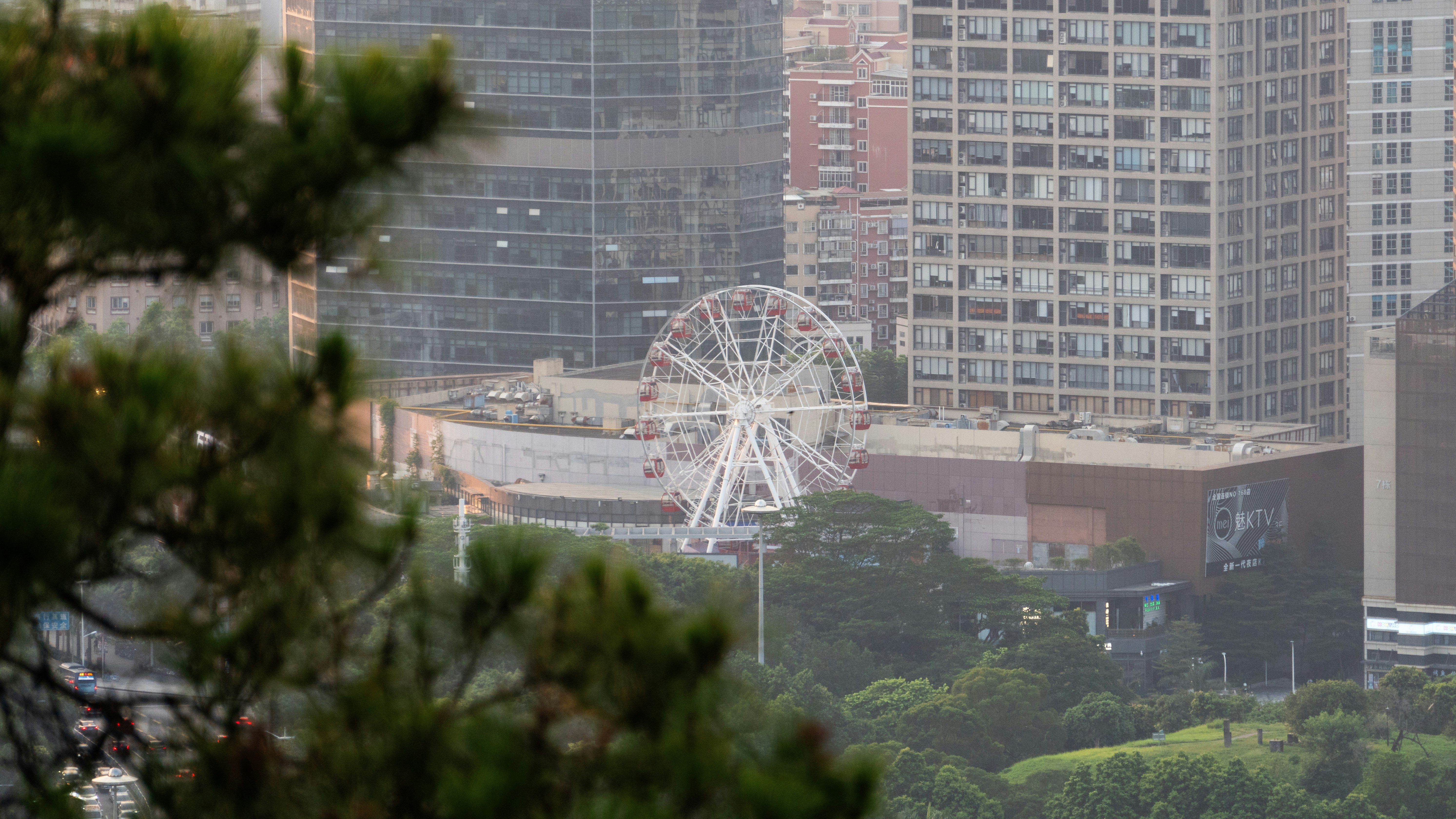Ferris Wheel in the Mist: Quiet drama over a glassy downtown skyline