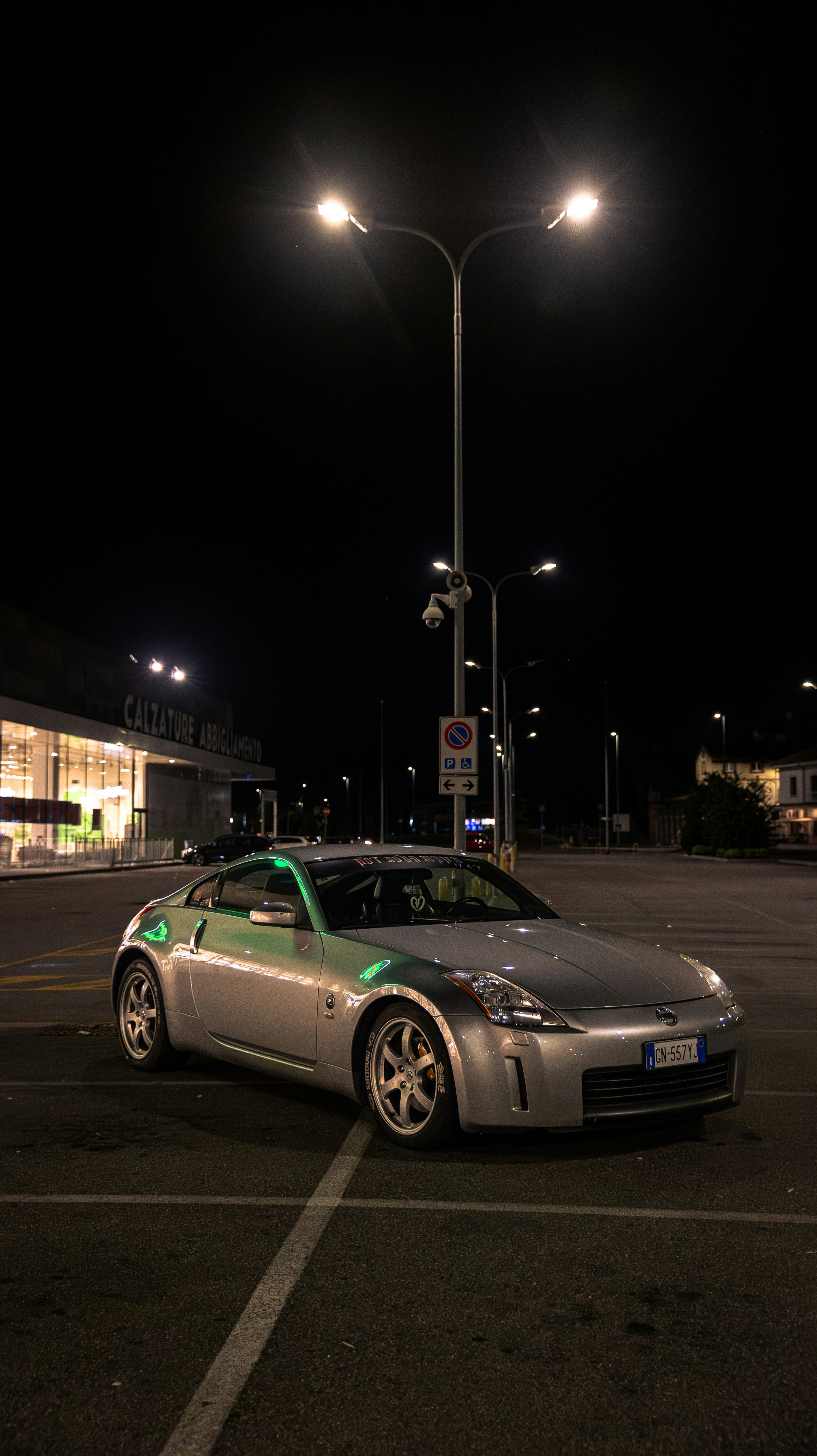 Nissan 350Z Under Twin Streetlights in a Quiet Night Parking Lot