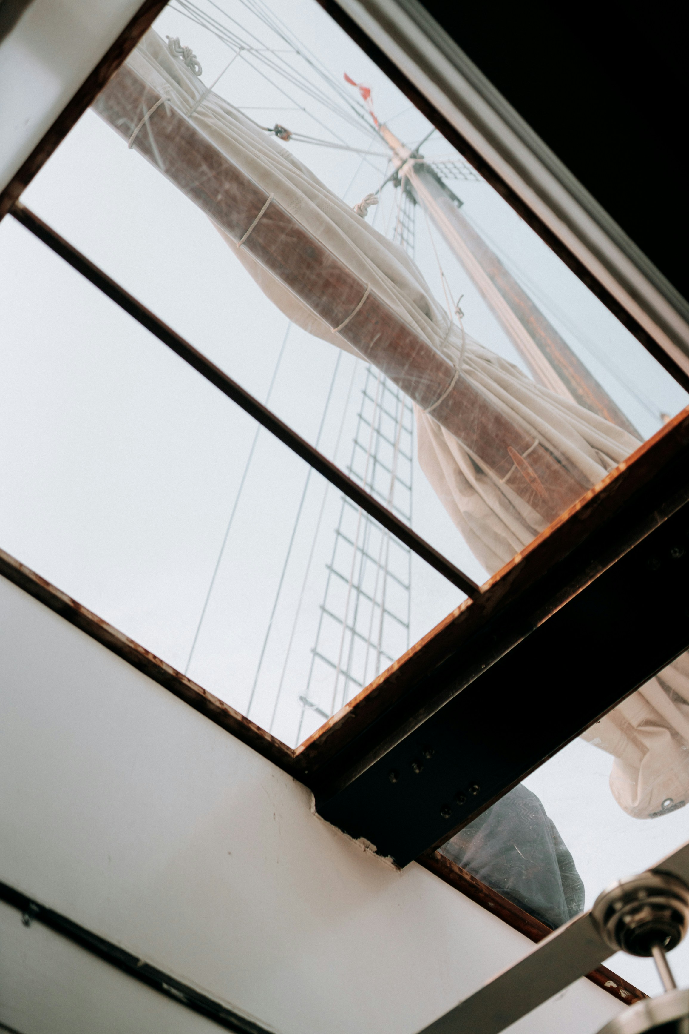Through Glass and Rigging: A Canted View of a Sailcloth Tower