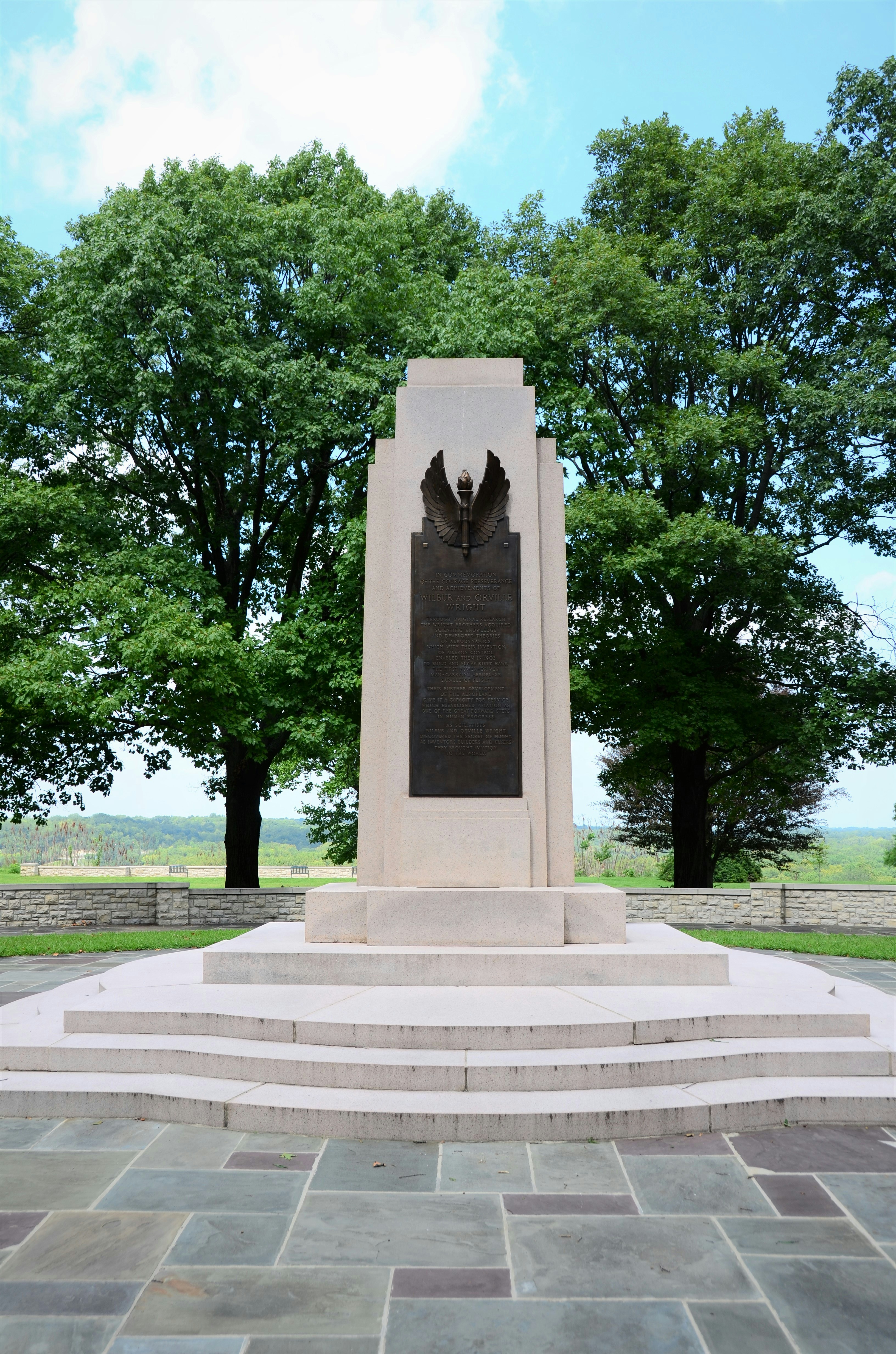 A monument with a tree in the background photo – Free Path Image on ...