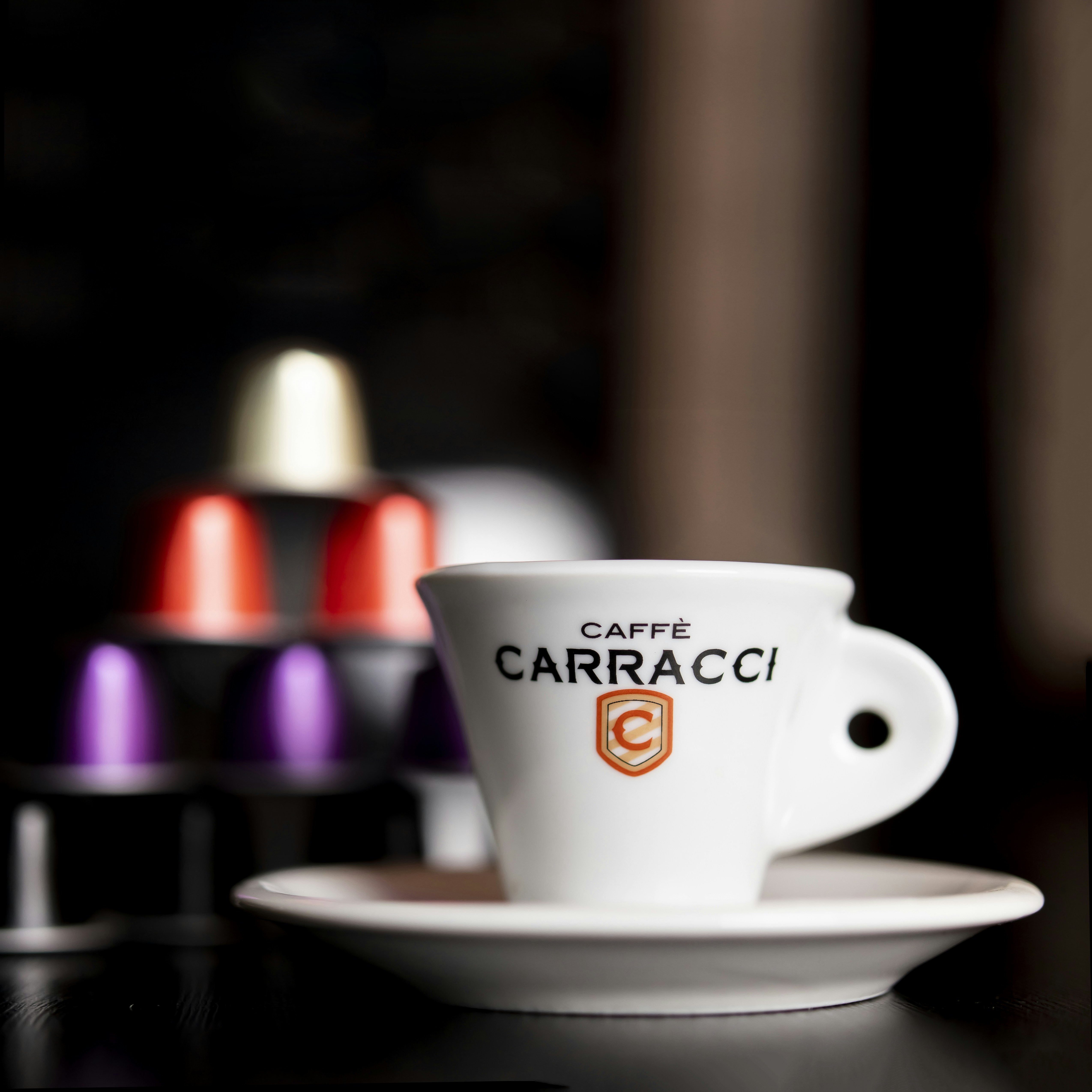 Espresso Portrait: The Caracca Cup and a Row of Nespresso-like Pods