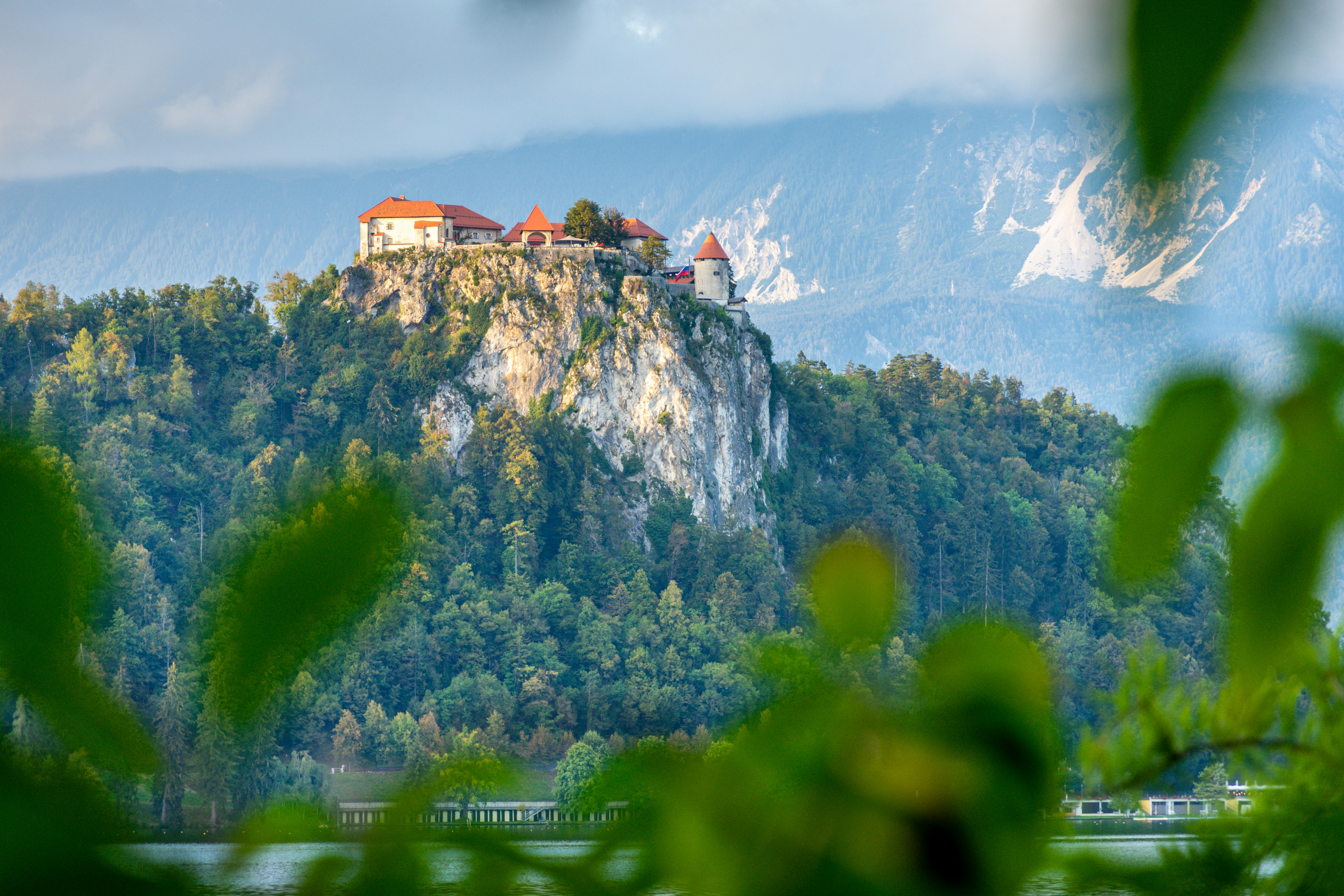 A castle on top of a mountain surrounded by trees photo – Free Slovenia ...