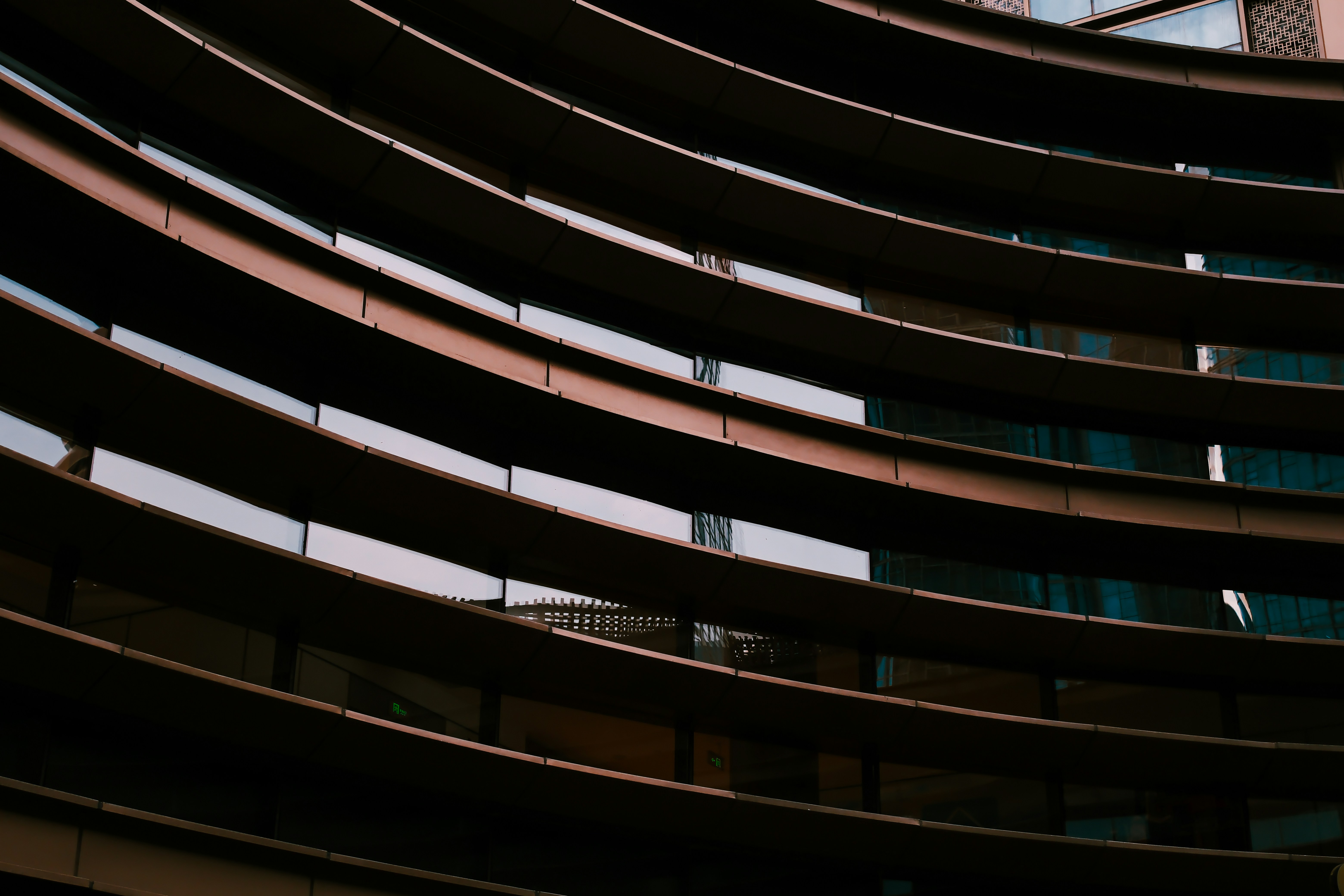 A curved building with a clock tower in the background photo – Free 北京市 ...