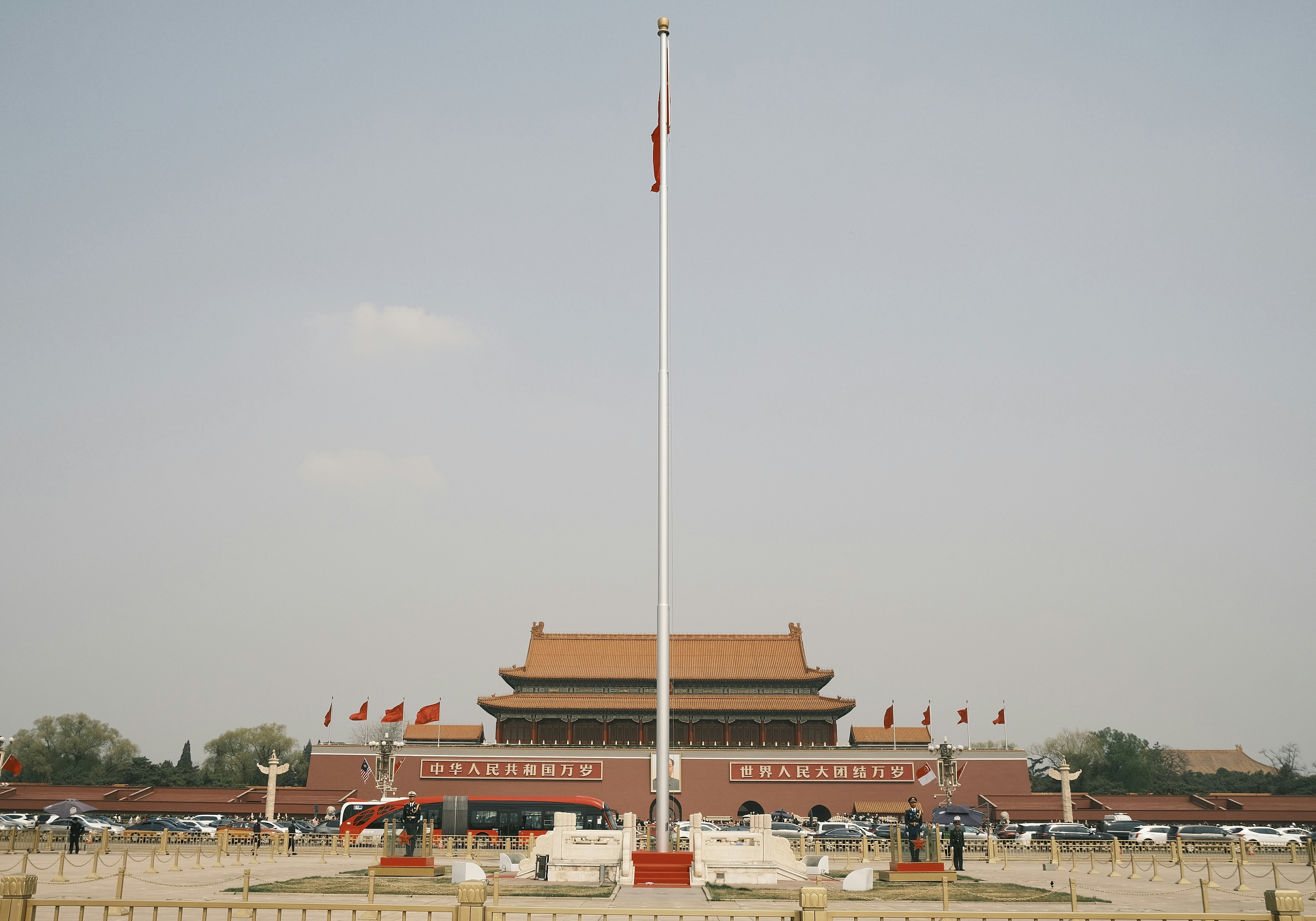 A tall flag pole in front of a building photo – Free Tiananmen square ...