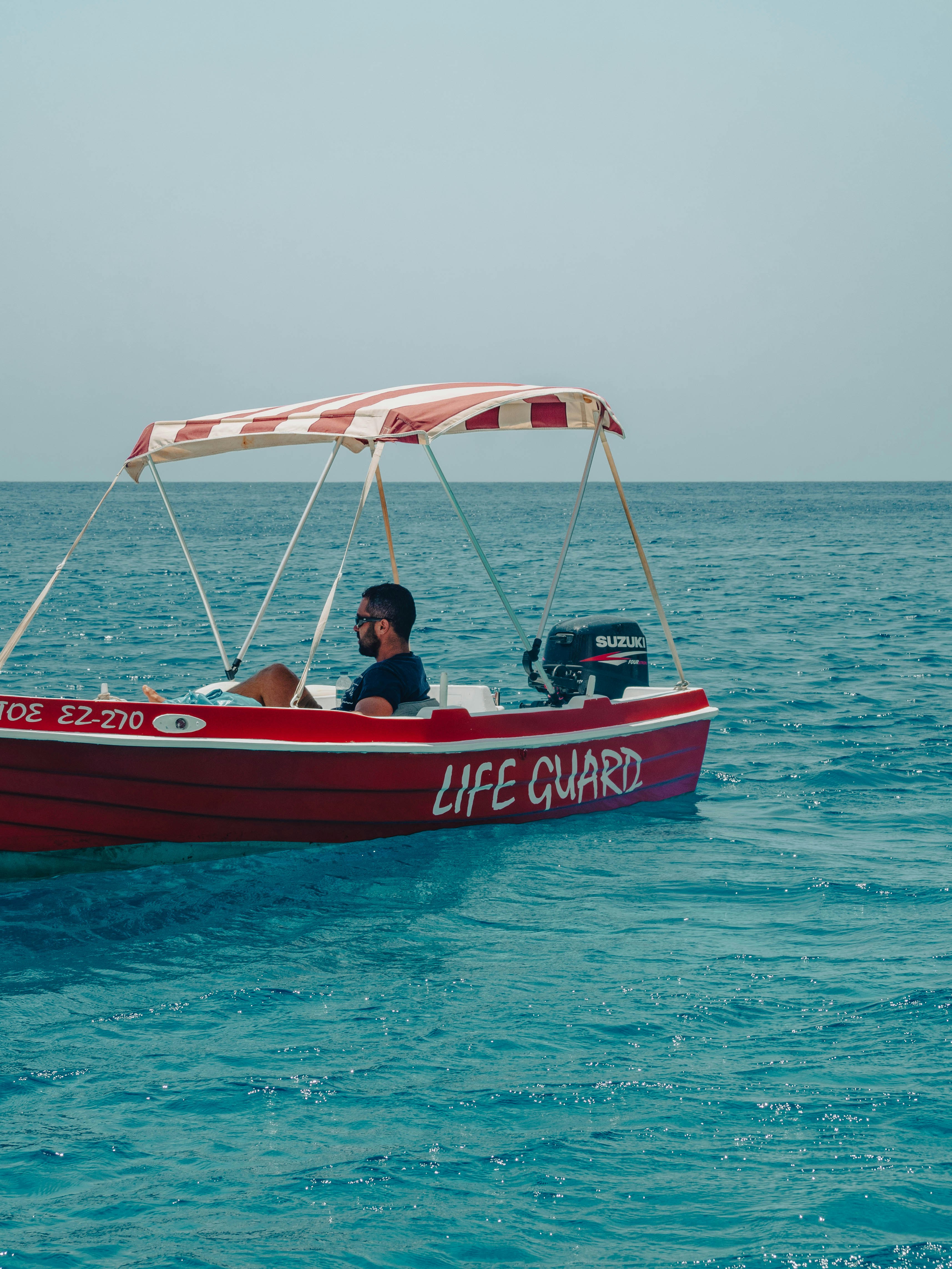 Crimson Lifeboat Against Caribbean Turquoise