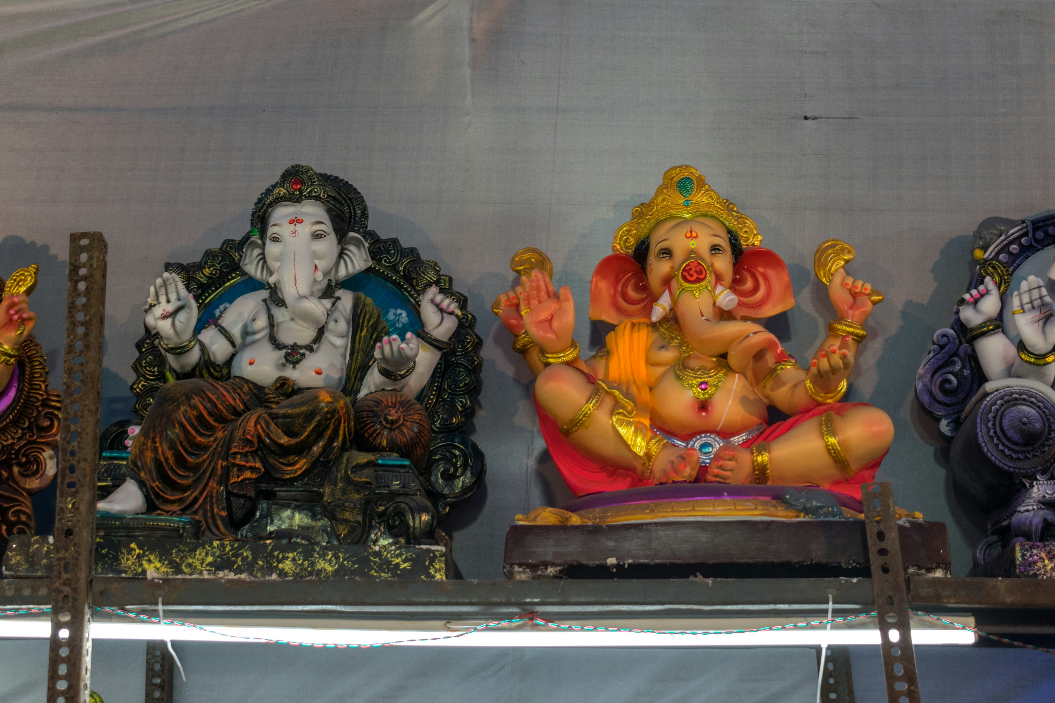 A row of statues of hindu deities on display photo – Free Maharashtra ...