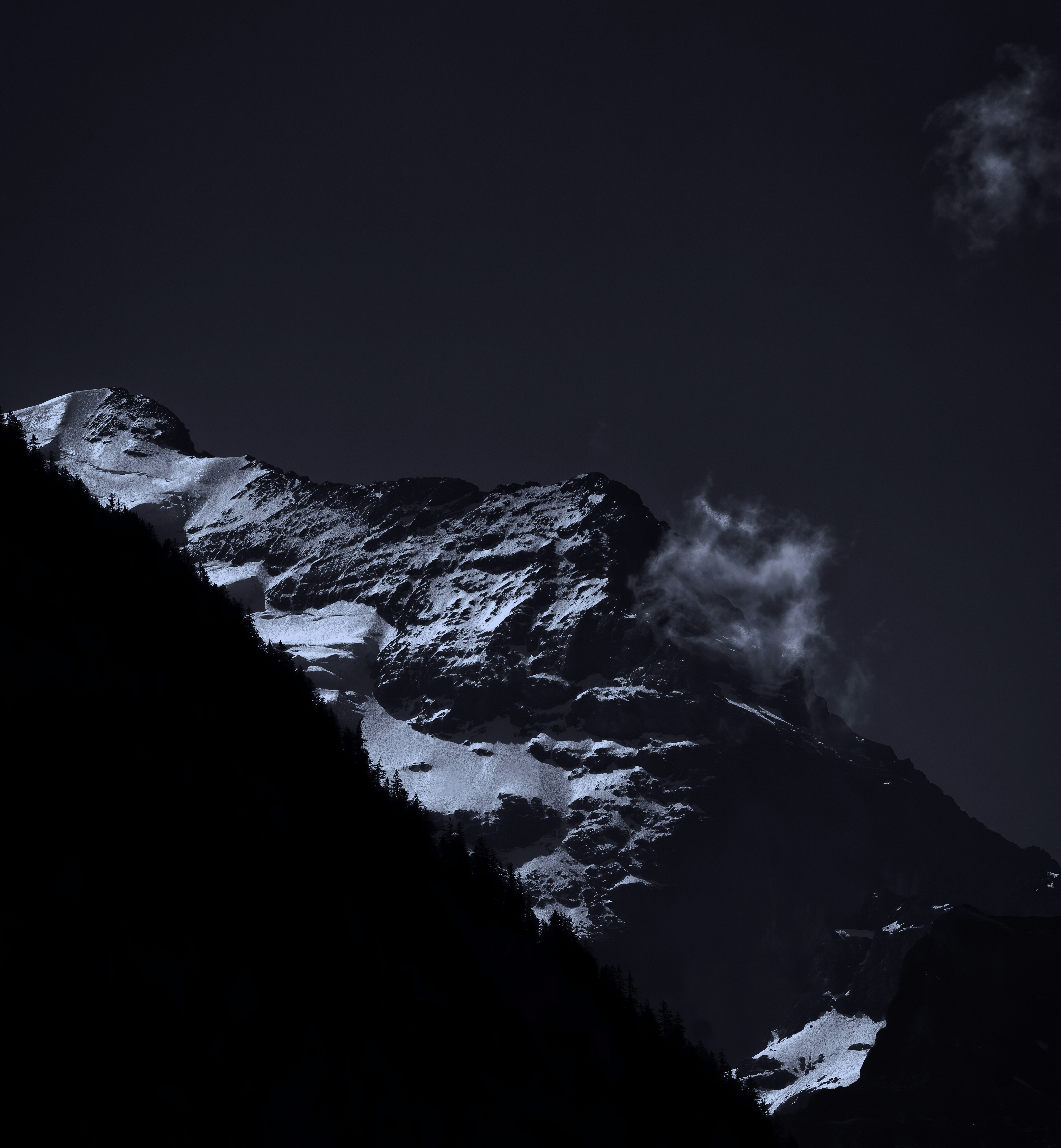 Diagonal snow | a snow covered mountain with a cloud in the sky