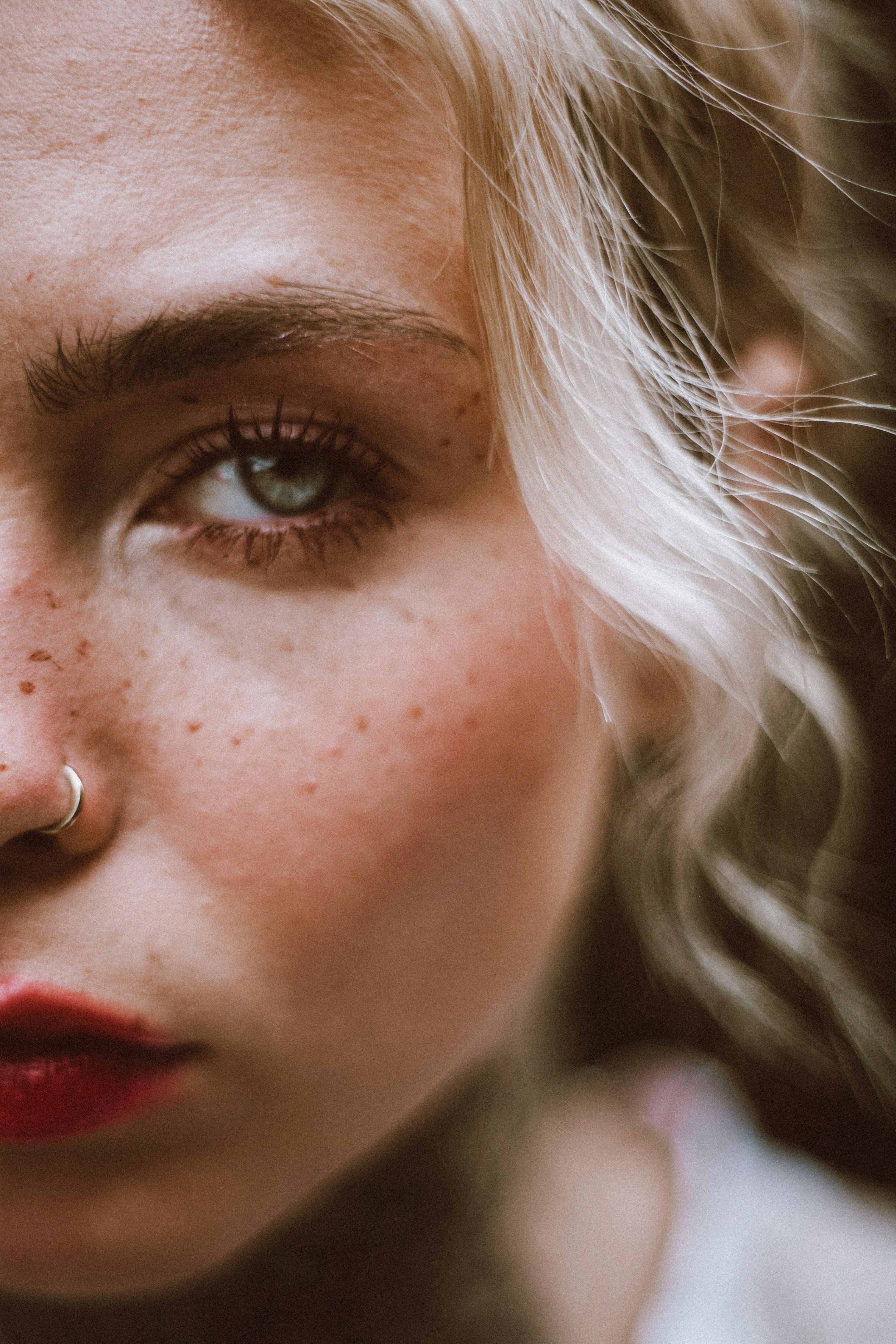 A close up of a woman with freckles on her nose photo – Free Person ...