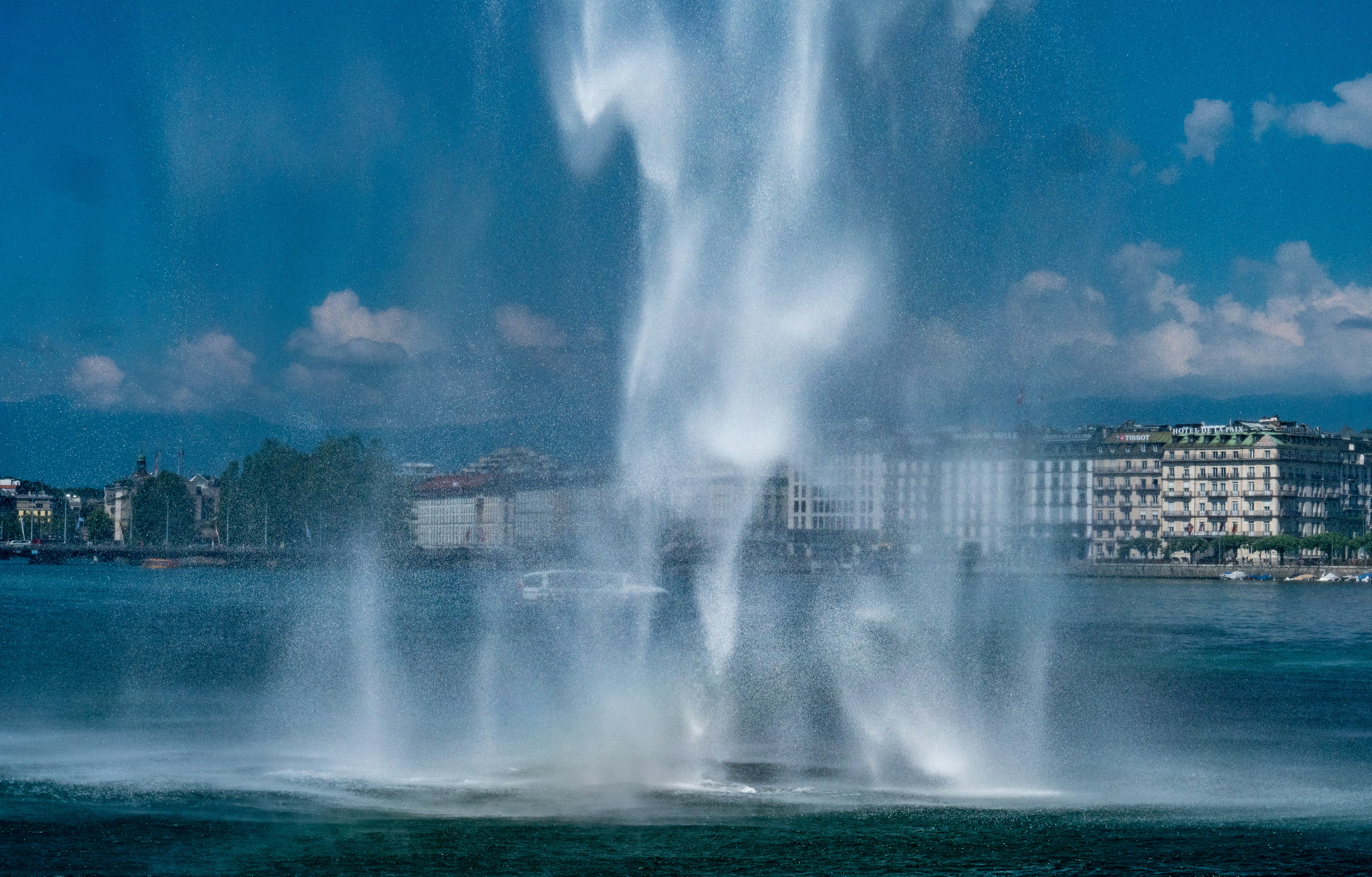 A large waterfall spewing water into the air photo – Free Genève Image ...