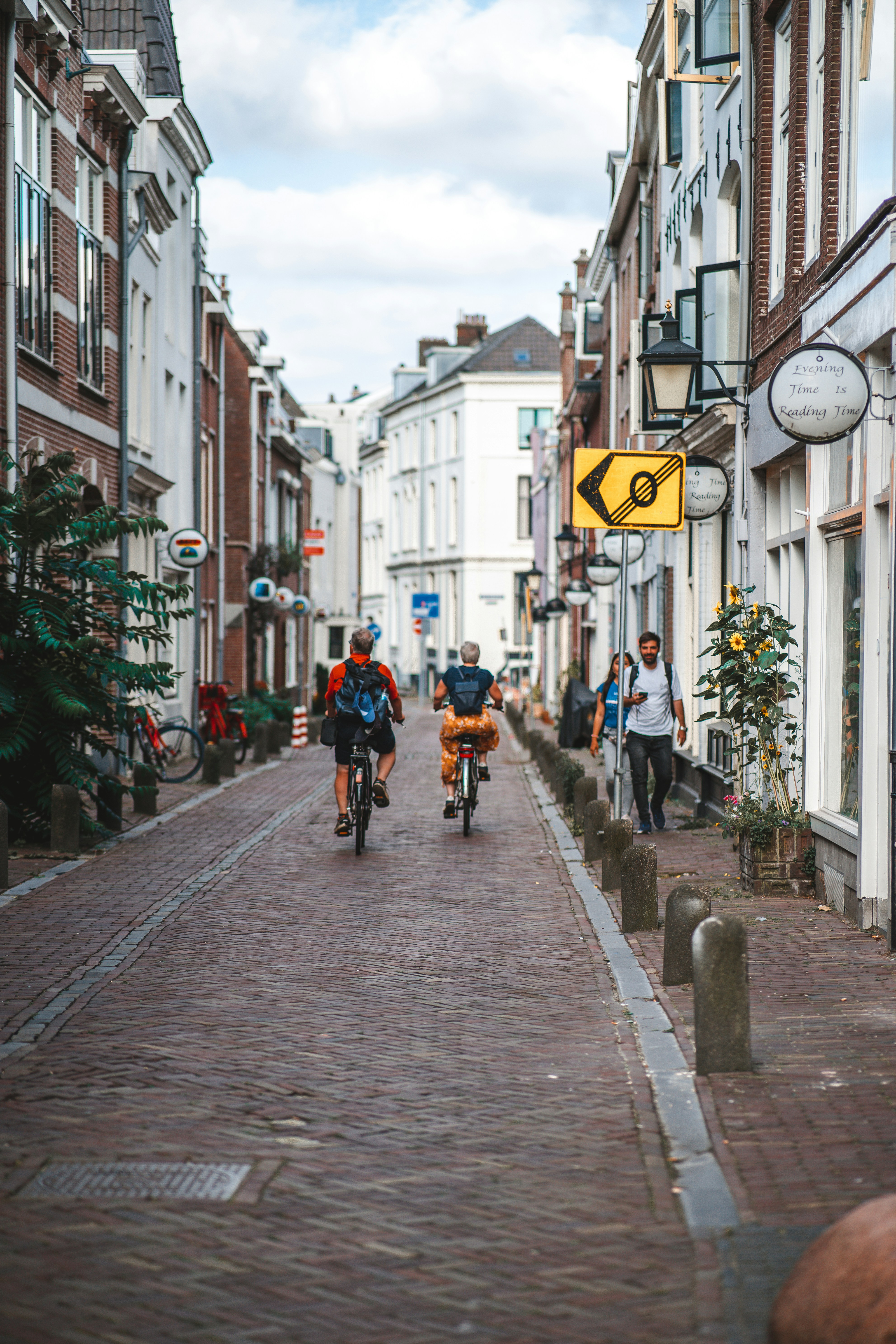 a couple of people riding bikes down a streetMatt Mutlu