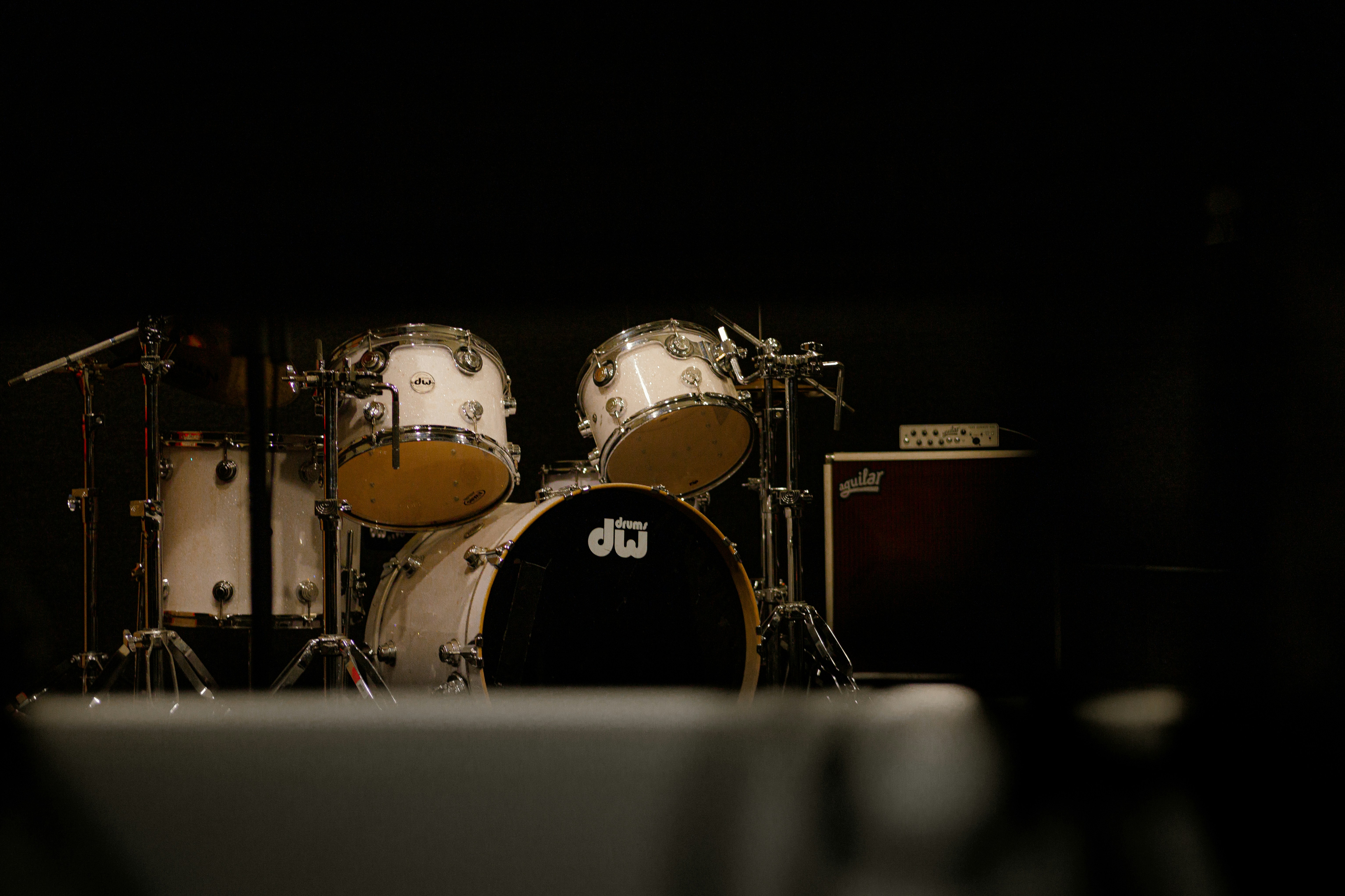A close up of a drum set in the dark photo – Free Musical instrument ...