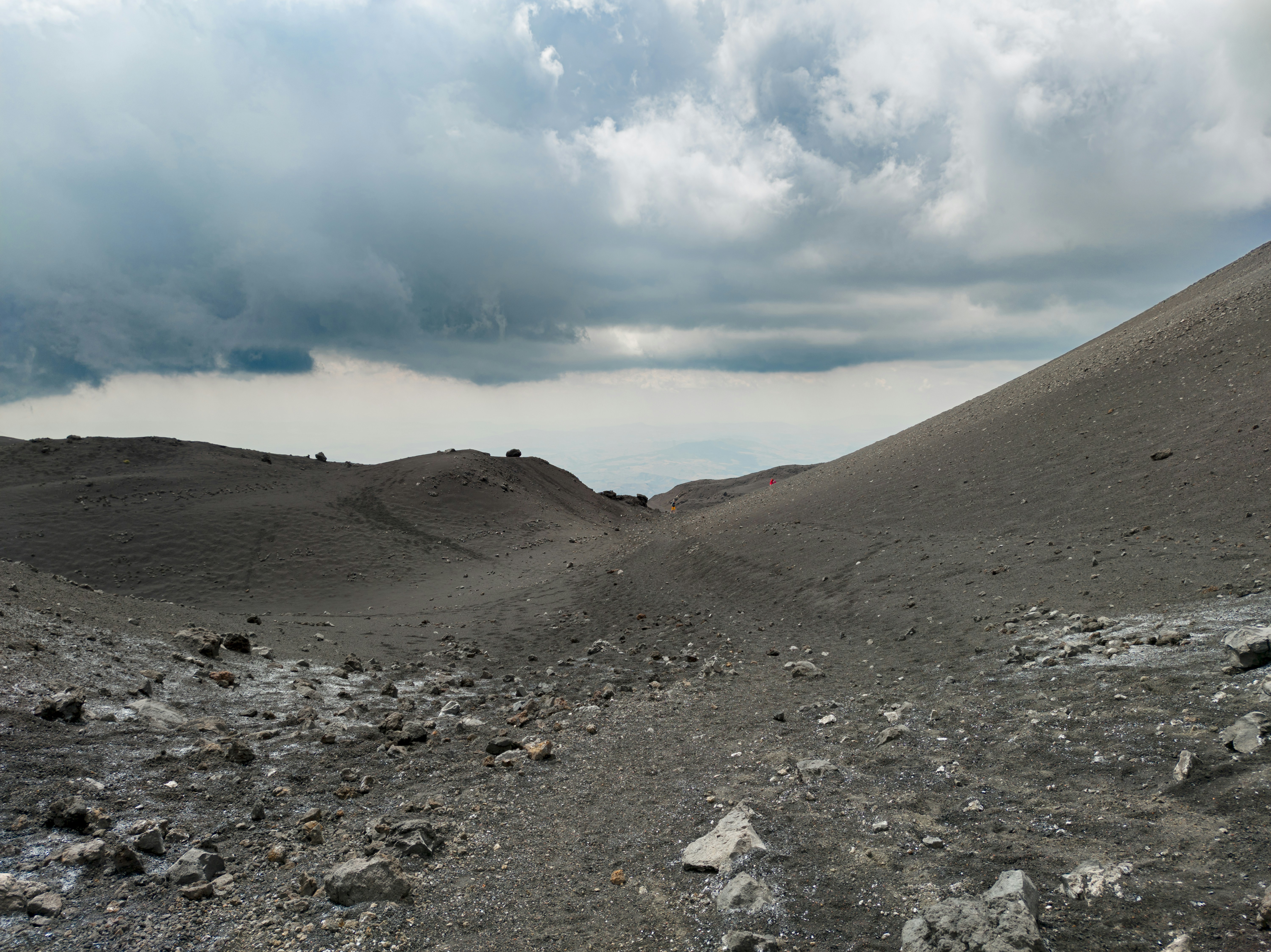 A barren area with rocks and gravel under a cloudy sky photo – Free ...