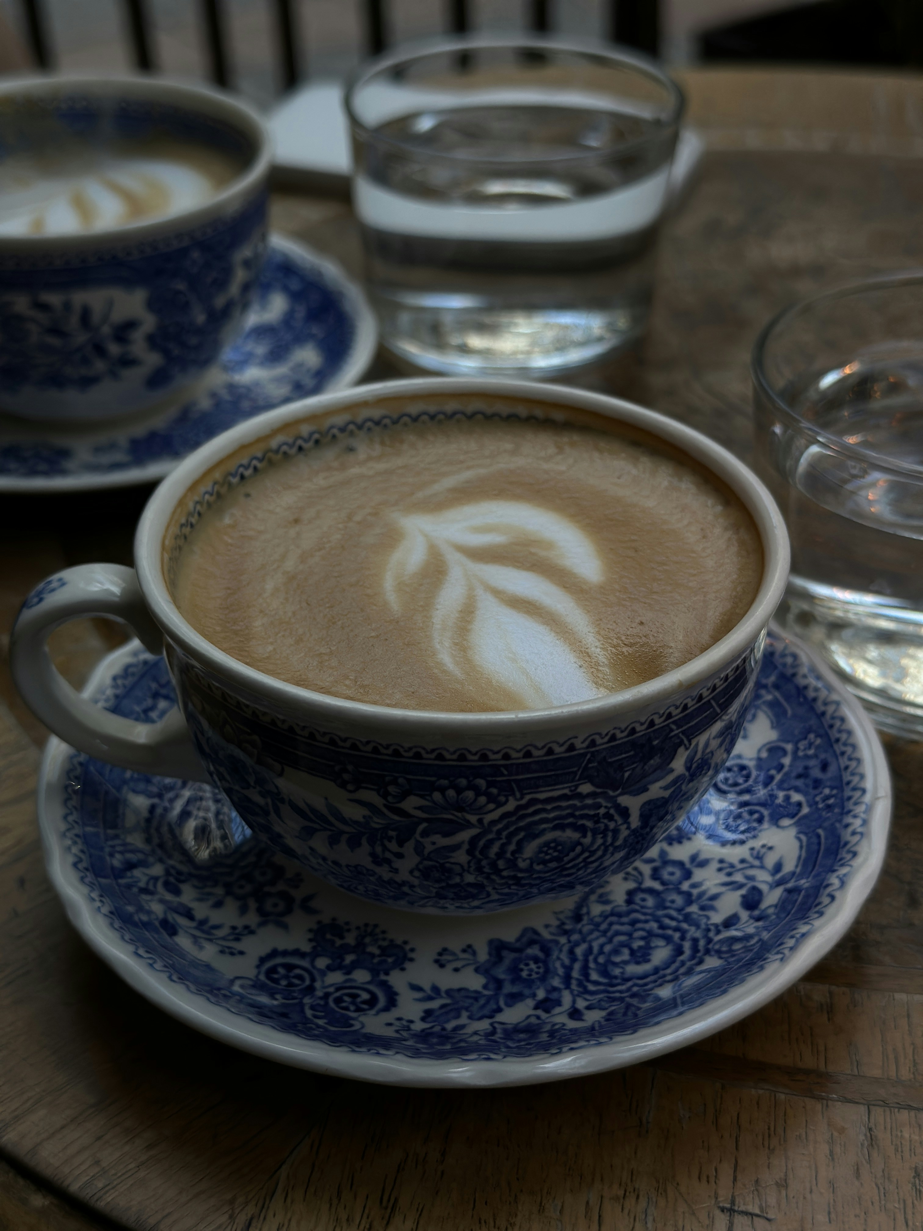Leaf Latte on Blue Porcelain: Quiet Café Moment