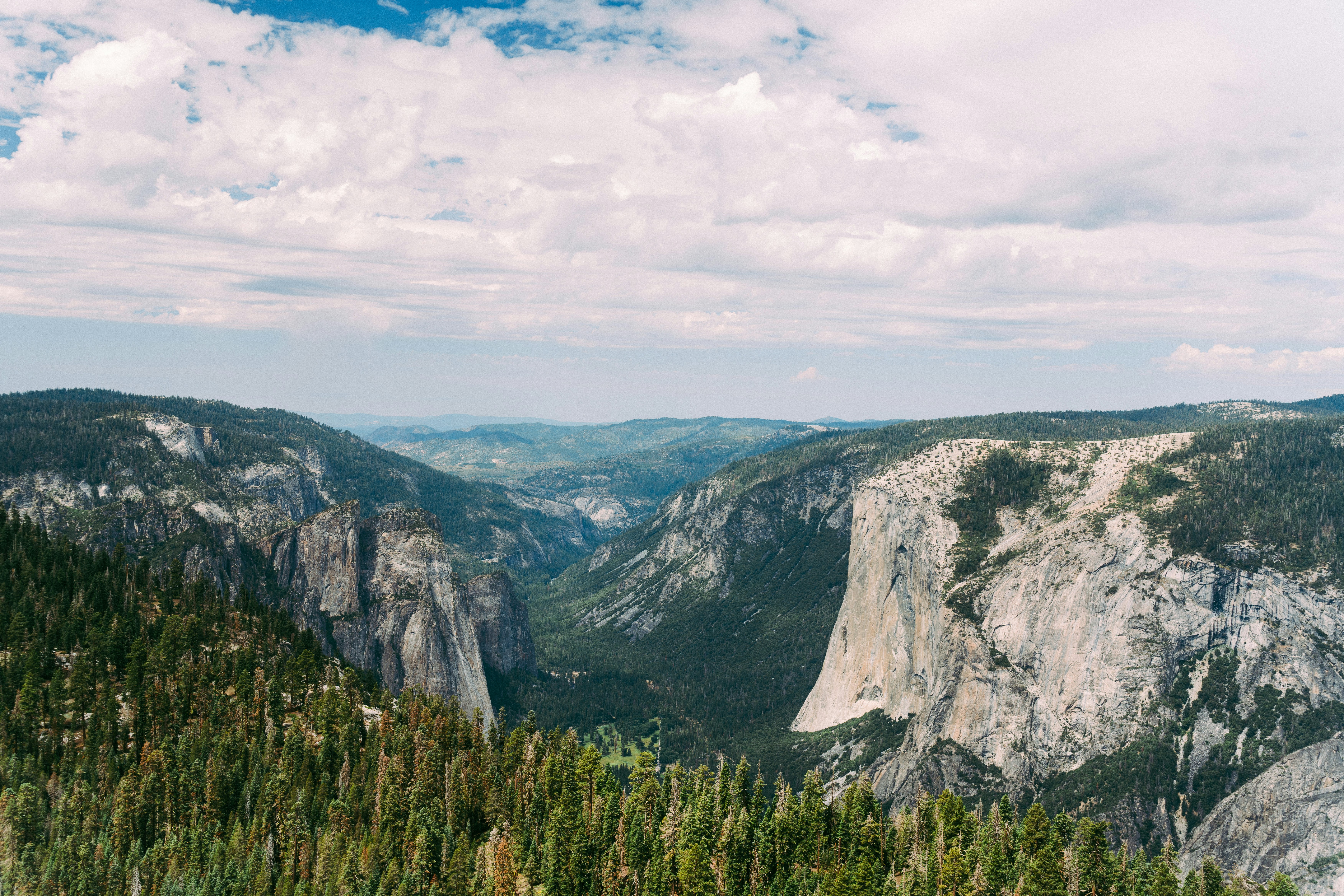 A scenic view of mountains and trees from a high viewpoint photo – Free ...