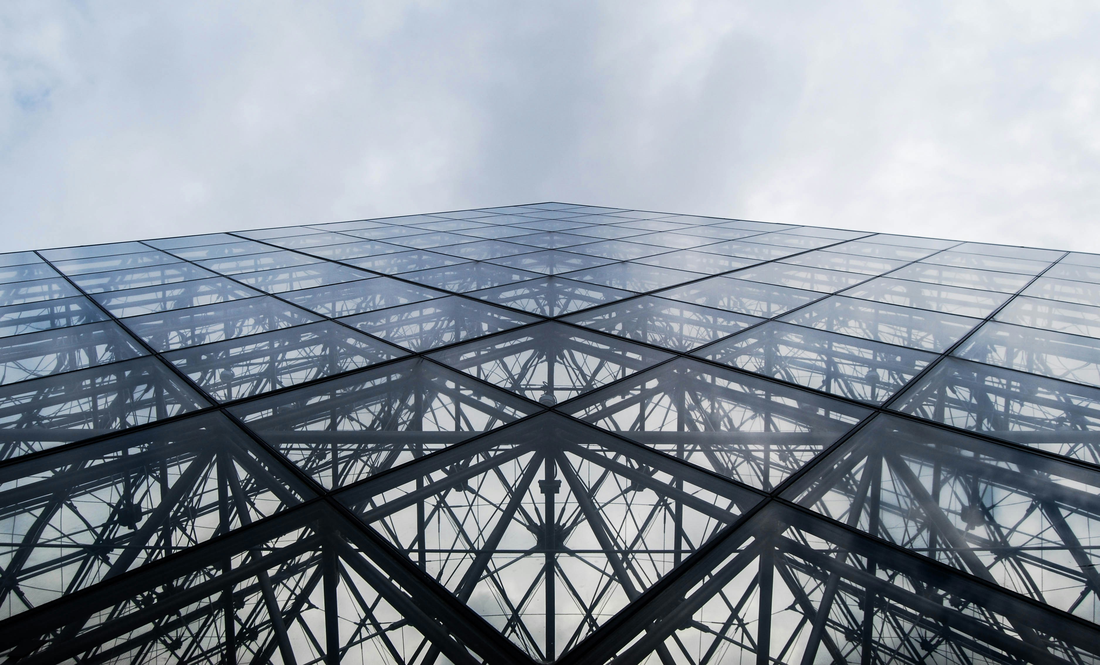 A very tall glass building with lots of windows photo – Free Louvre ...