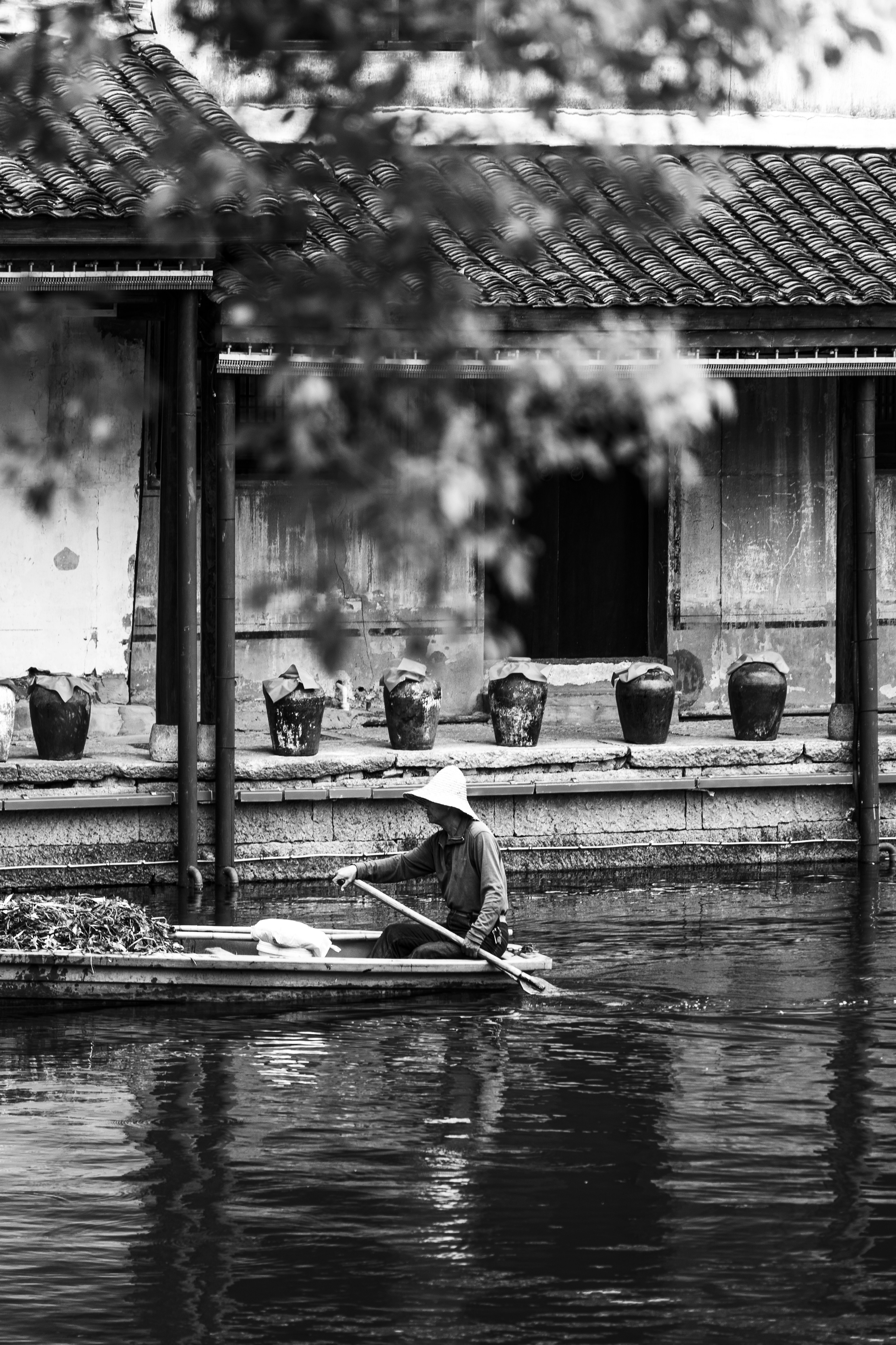 Conical-Hat Rowing Along a Weathered CanalfrontJeffrey Zhang