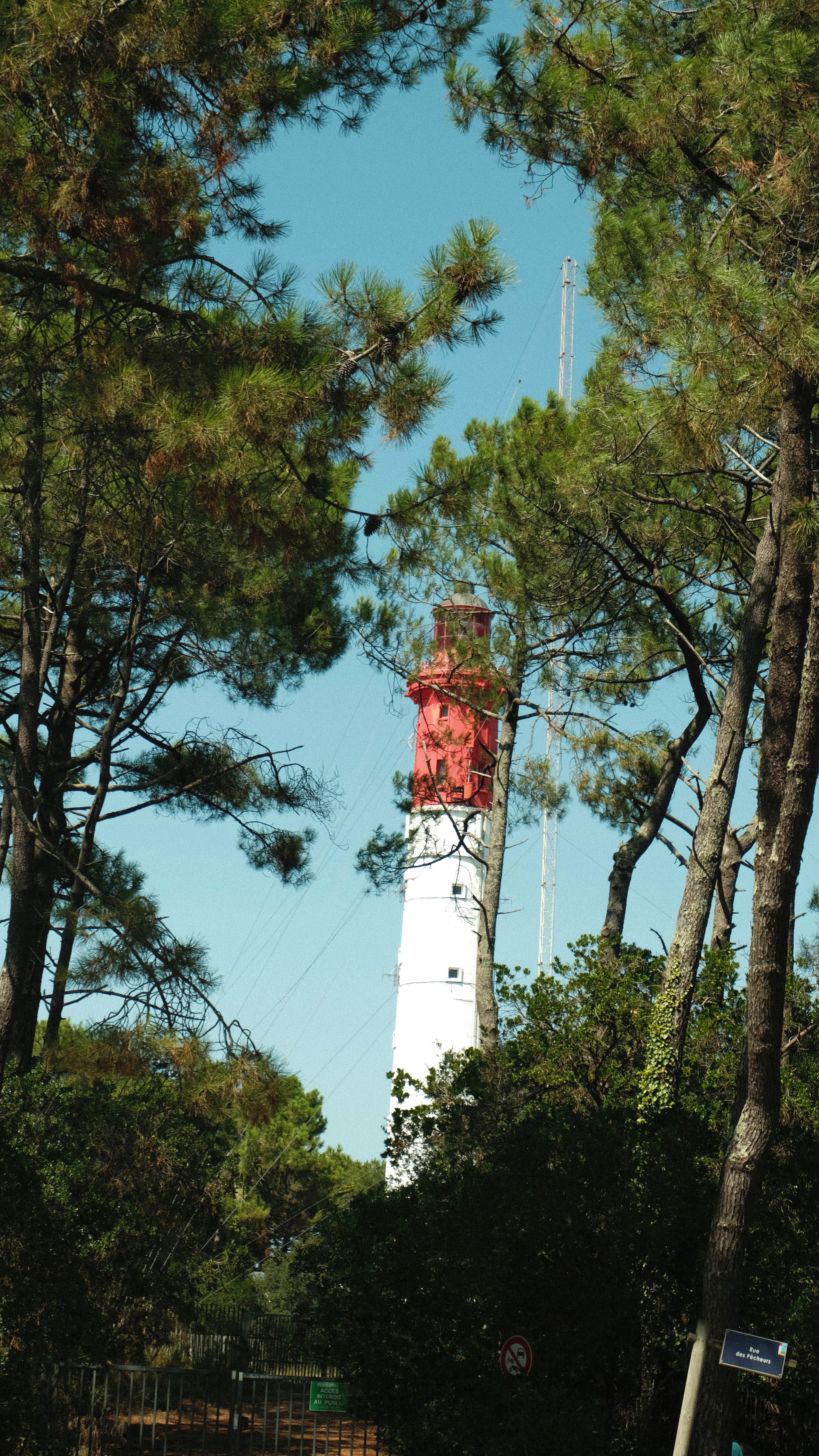 A red fire hydrant sitting on top of a tall white tower photo – Free ...