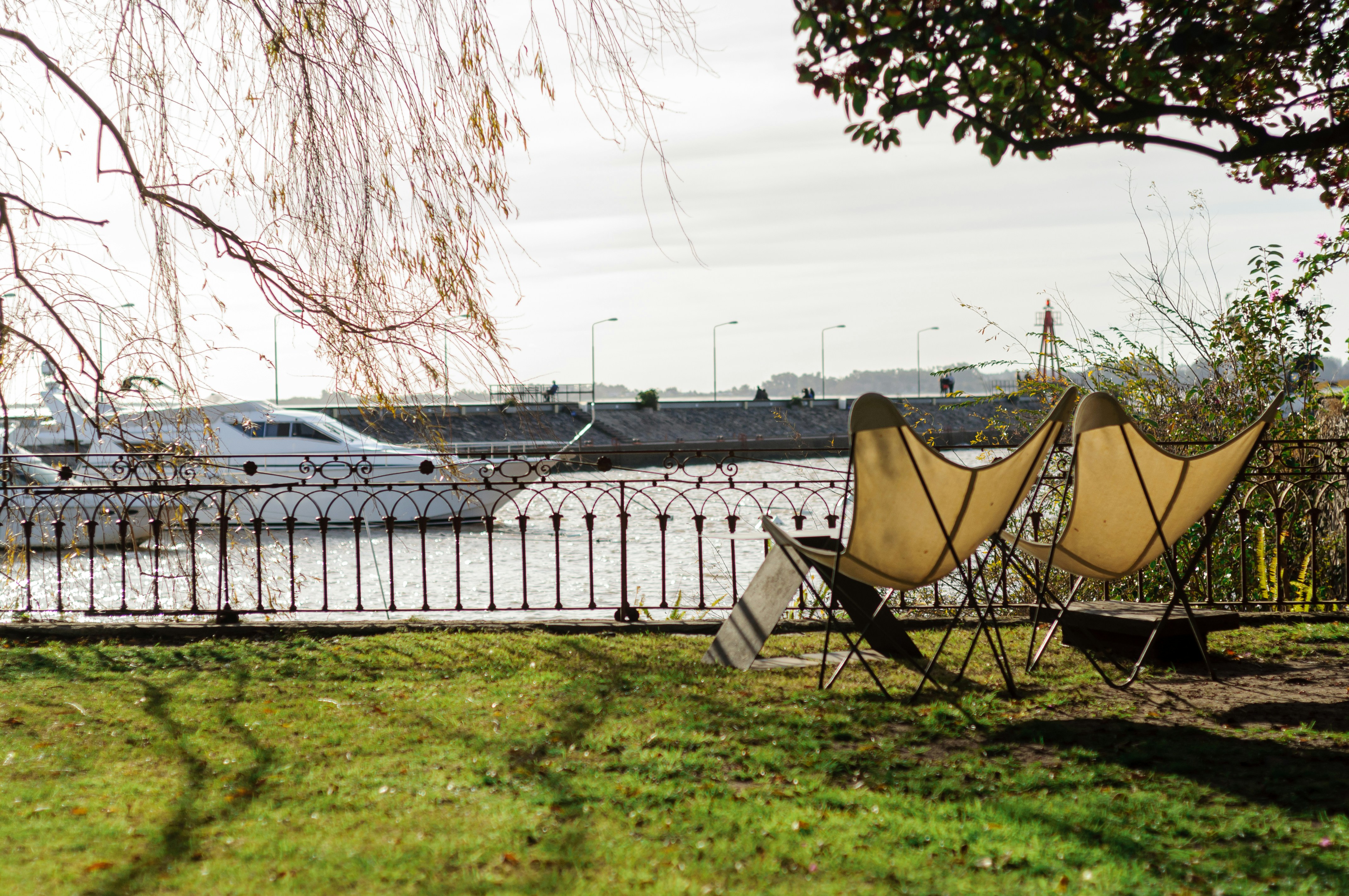 Riverside Lounge: Chairs by the Fence with a Waterfront View