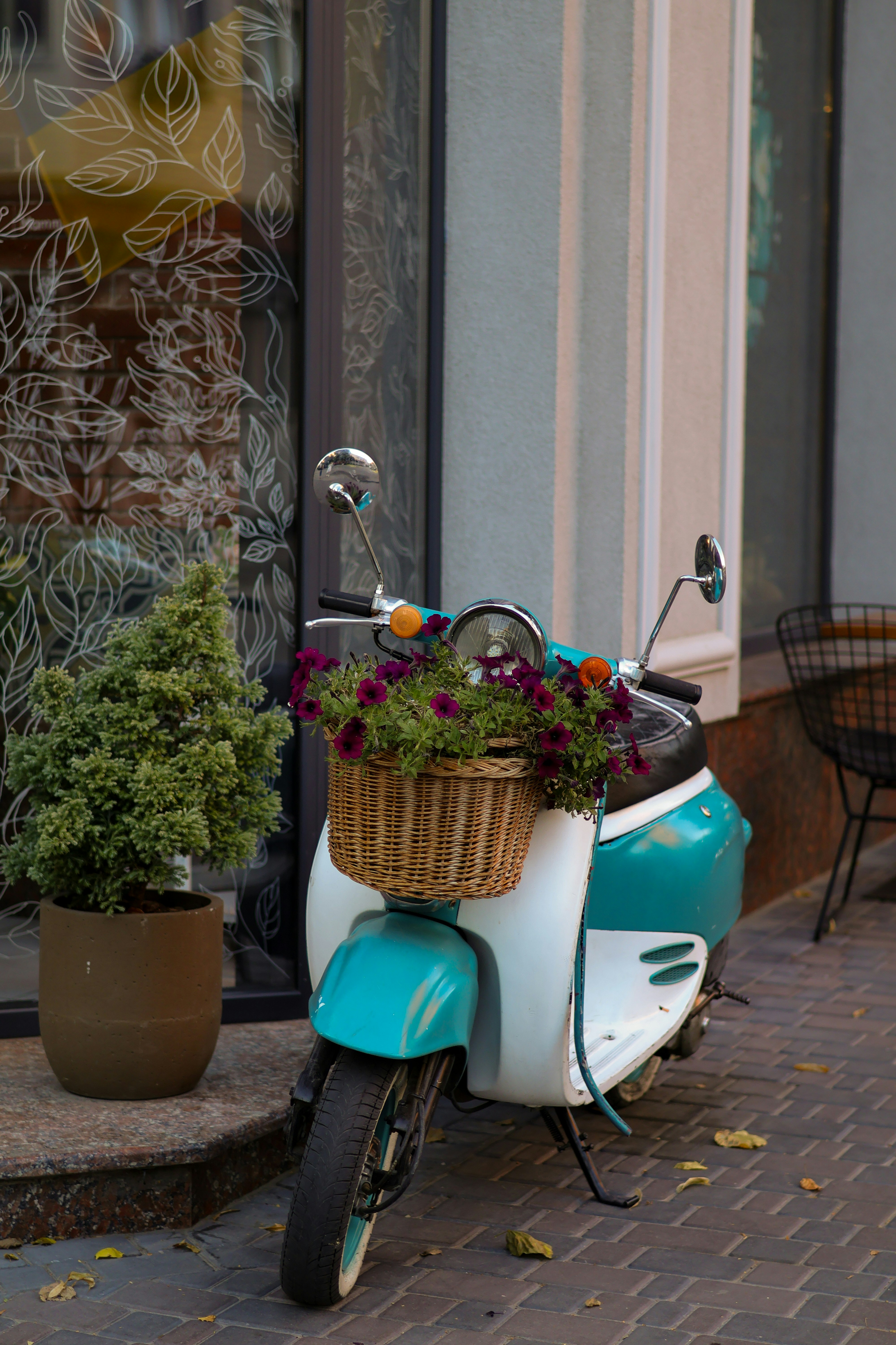 A Floral Embrace: The Vintage Scooter's Charm