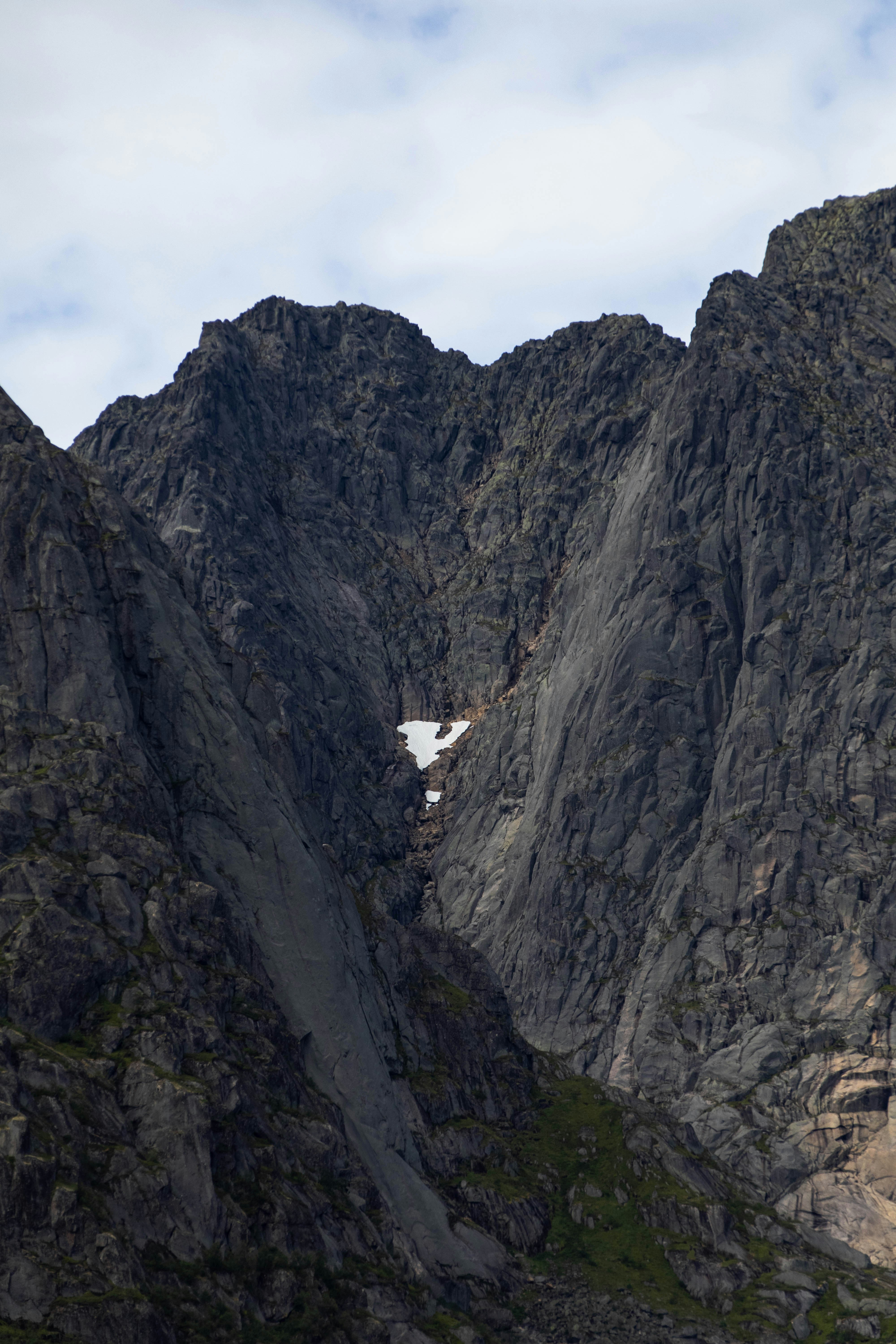 A very tall mountain with a very steep face photo – Free Norway Image ...